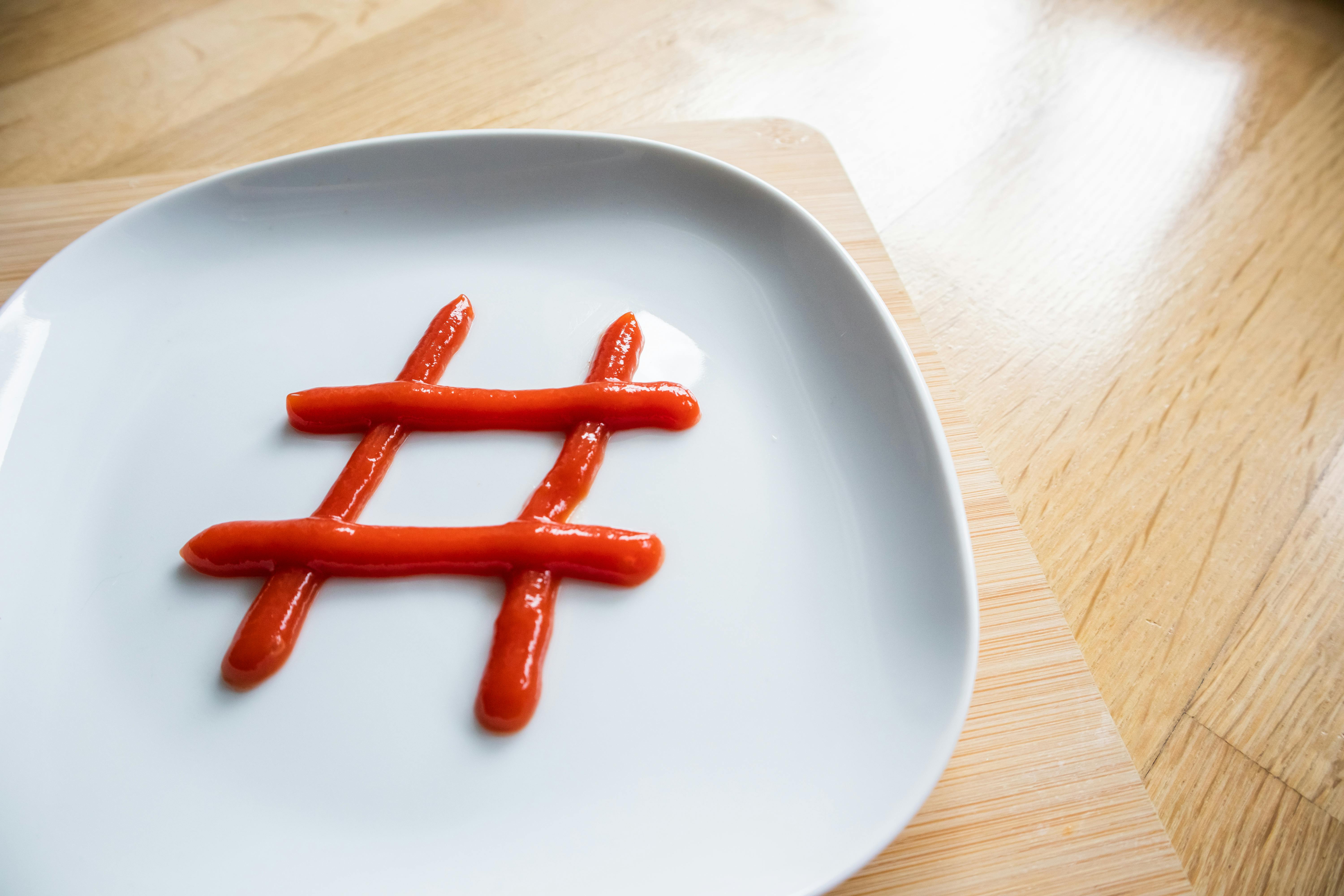 Hashtag Drawing on White Plate with Ketchup · Free Stock Photo