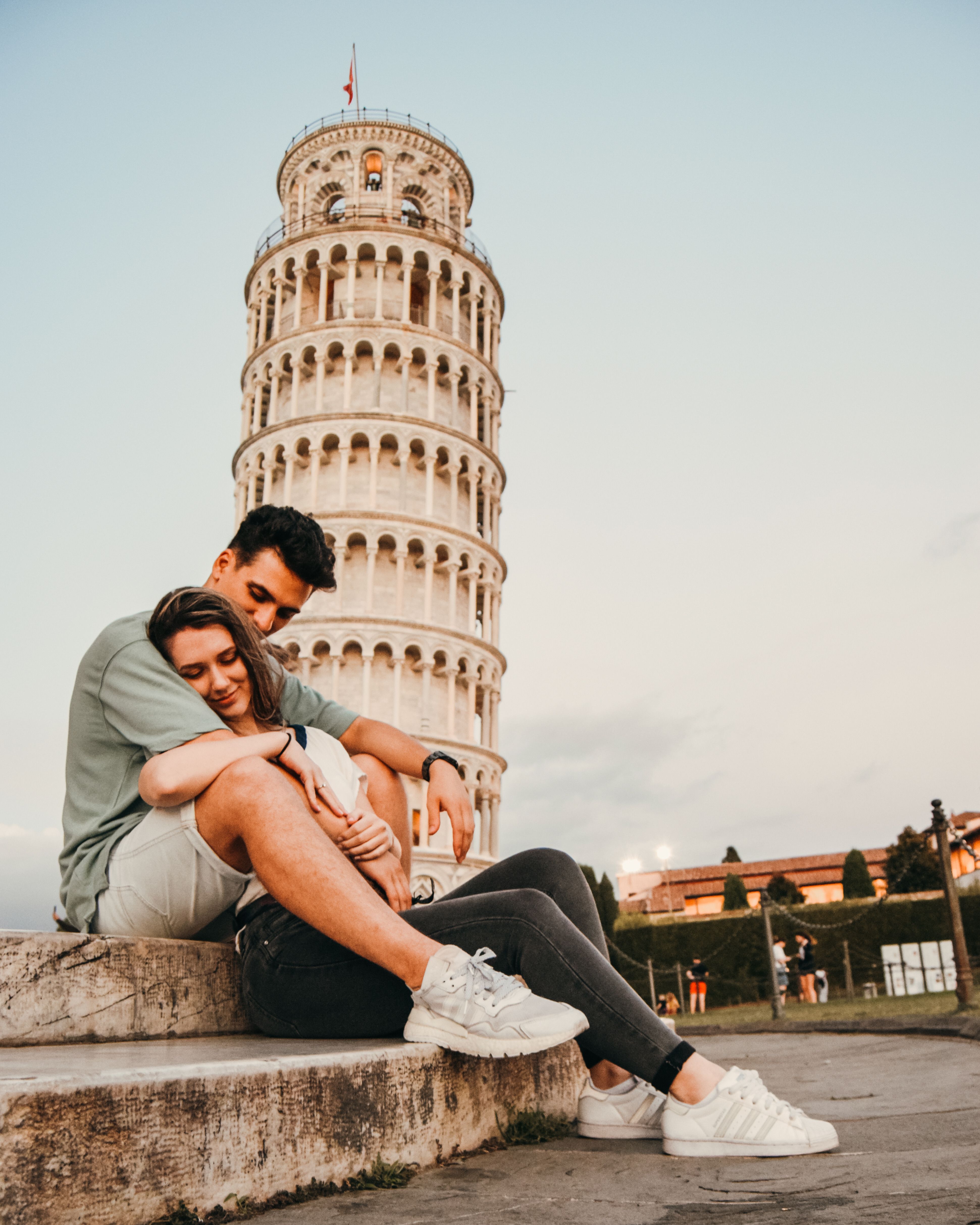 Couple Hugging under Tower of Pisa · Free Stock Photo