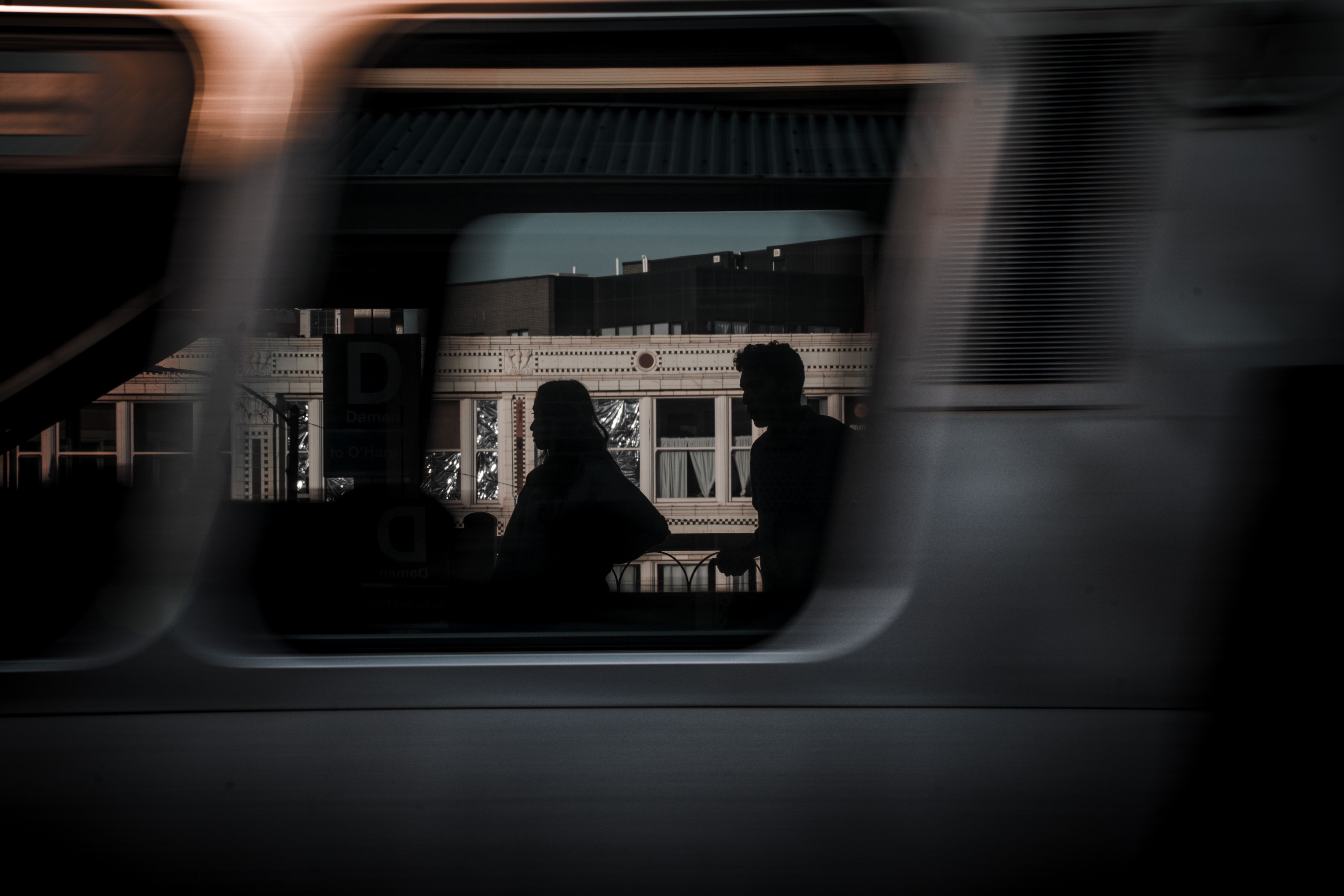 Silhouette of Man and Woman behind Window · Free Stock Photo