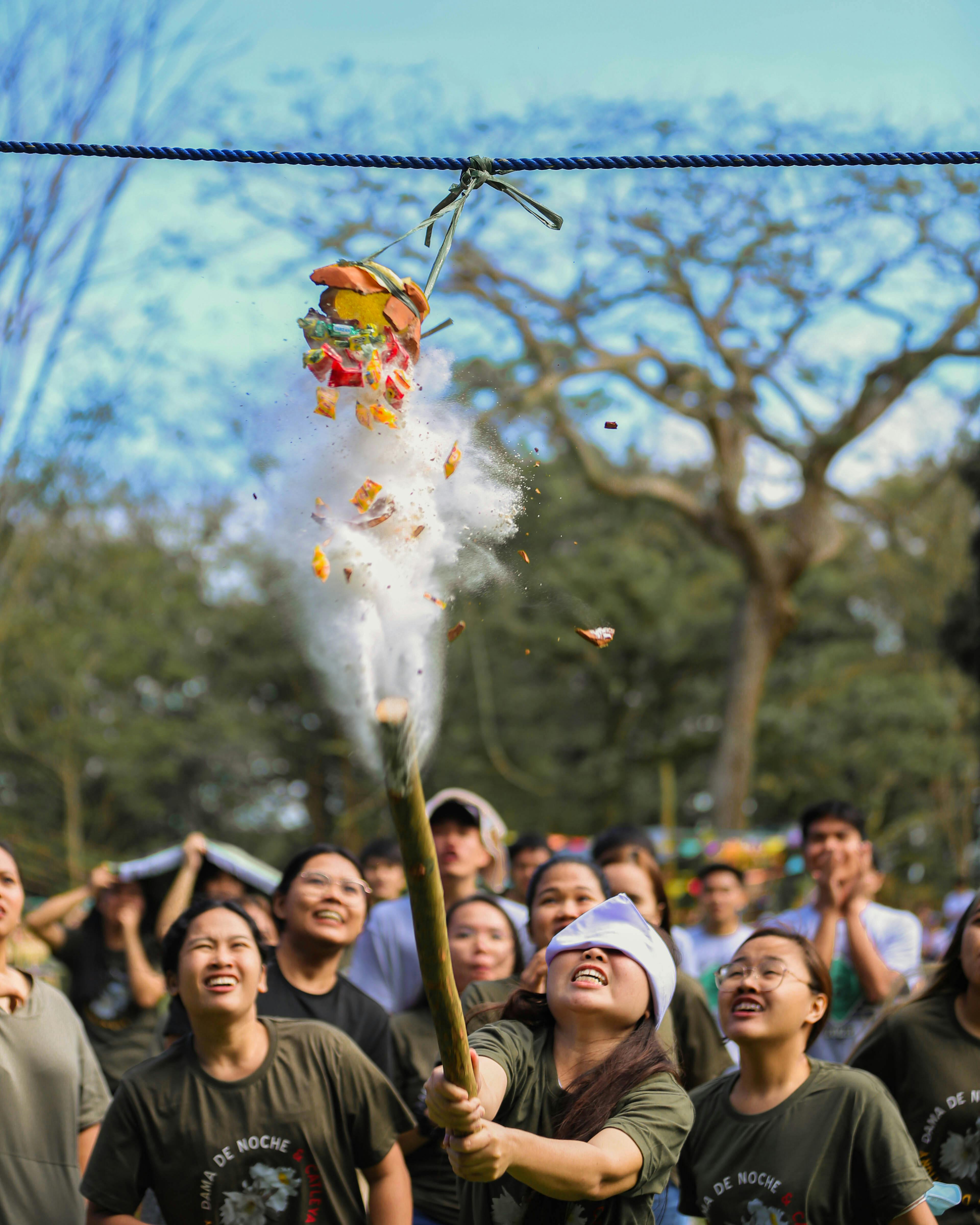 People Hitting Pinata · Free Stock Photo