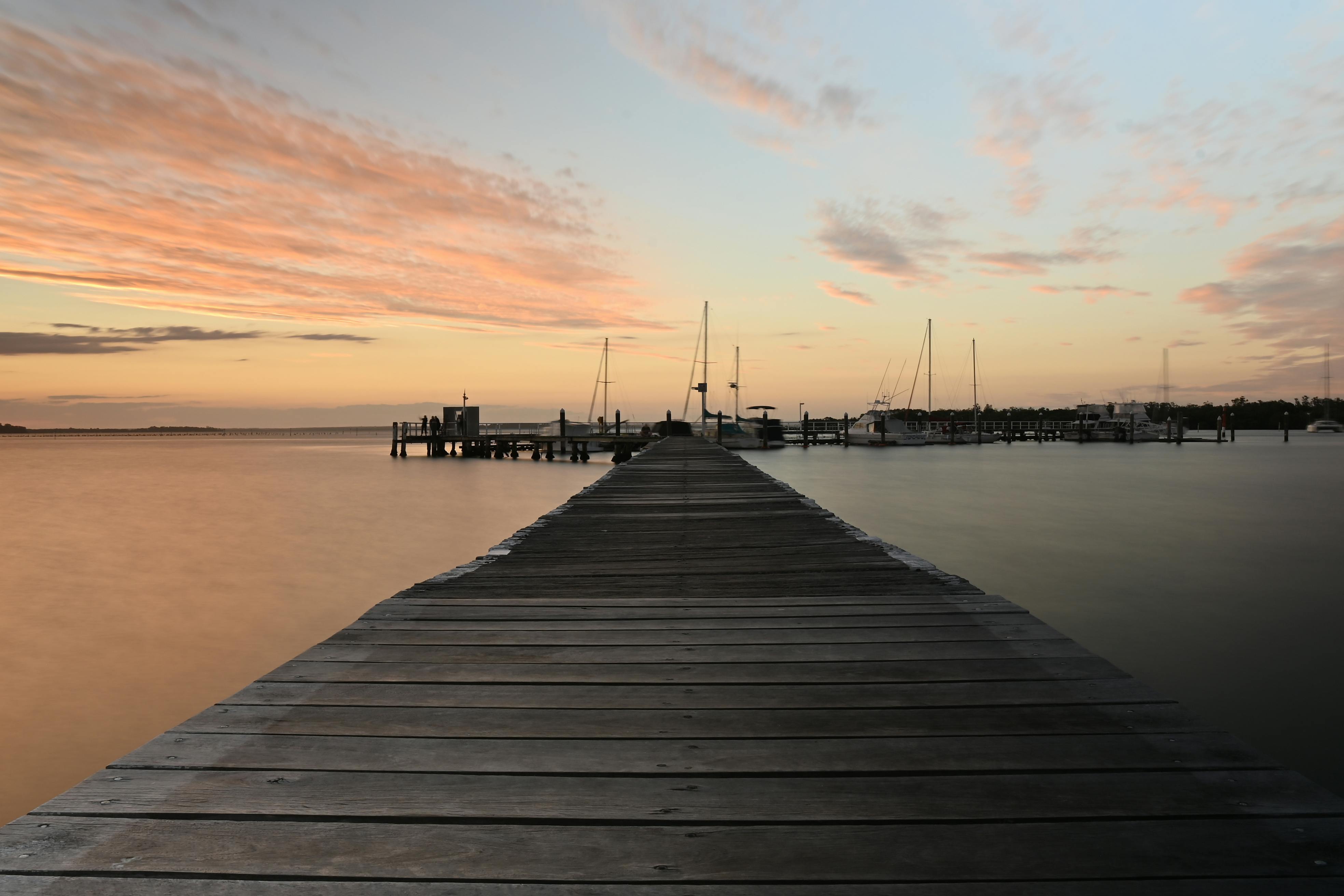 Wooden Dock on Sea Shore With Light Post during Sunset · Free Stock Photo