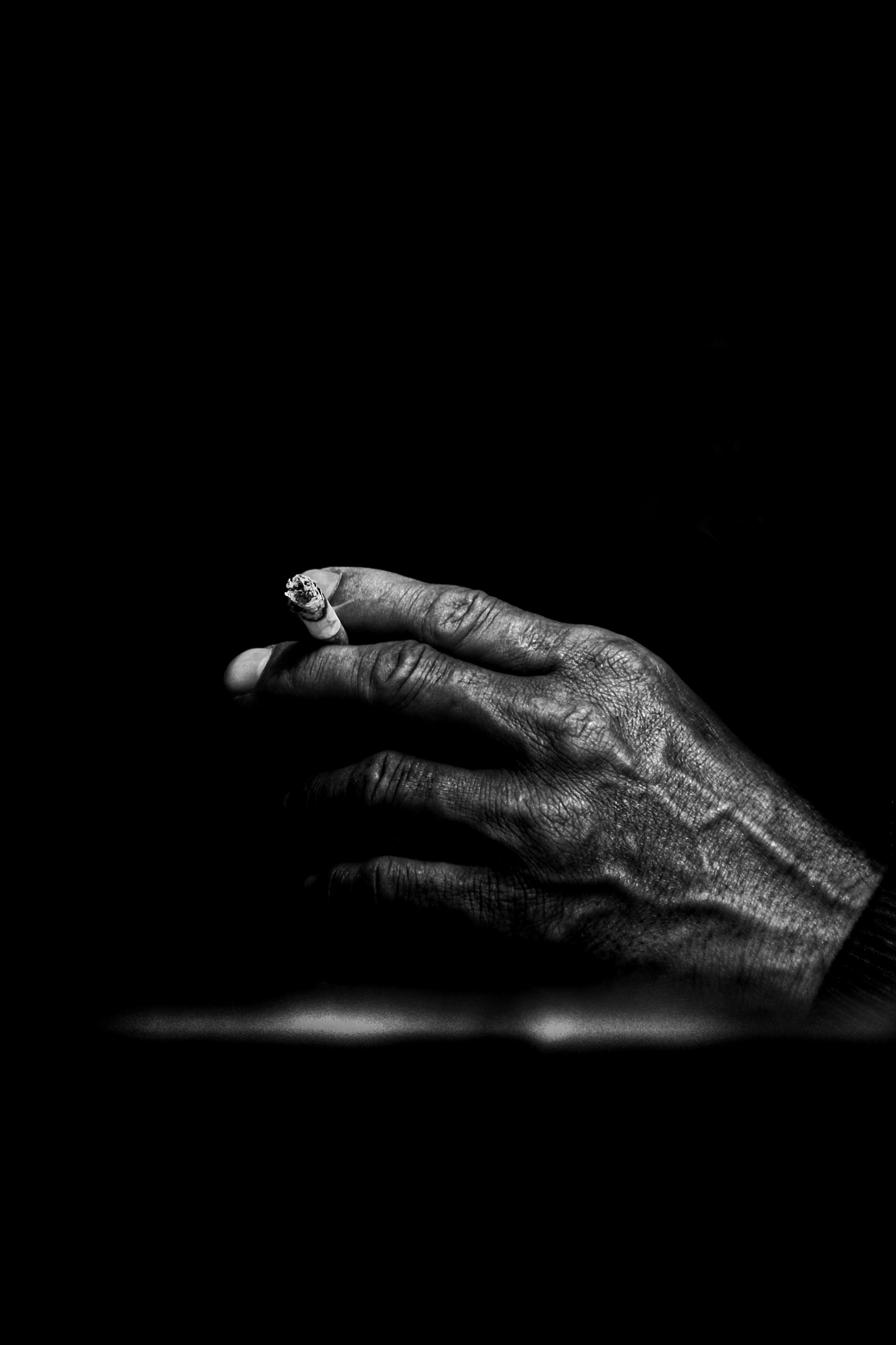 Monochrome Photo of Person's Hand · Free Stock Photo