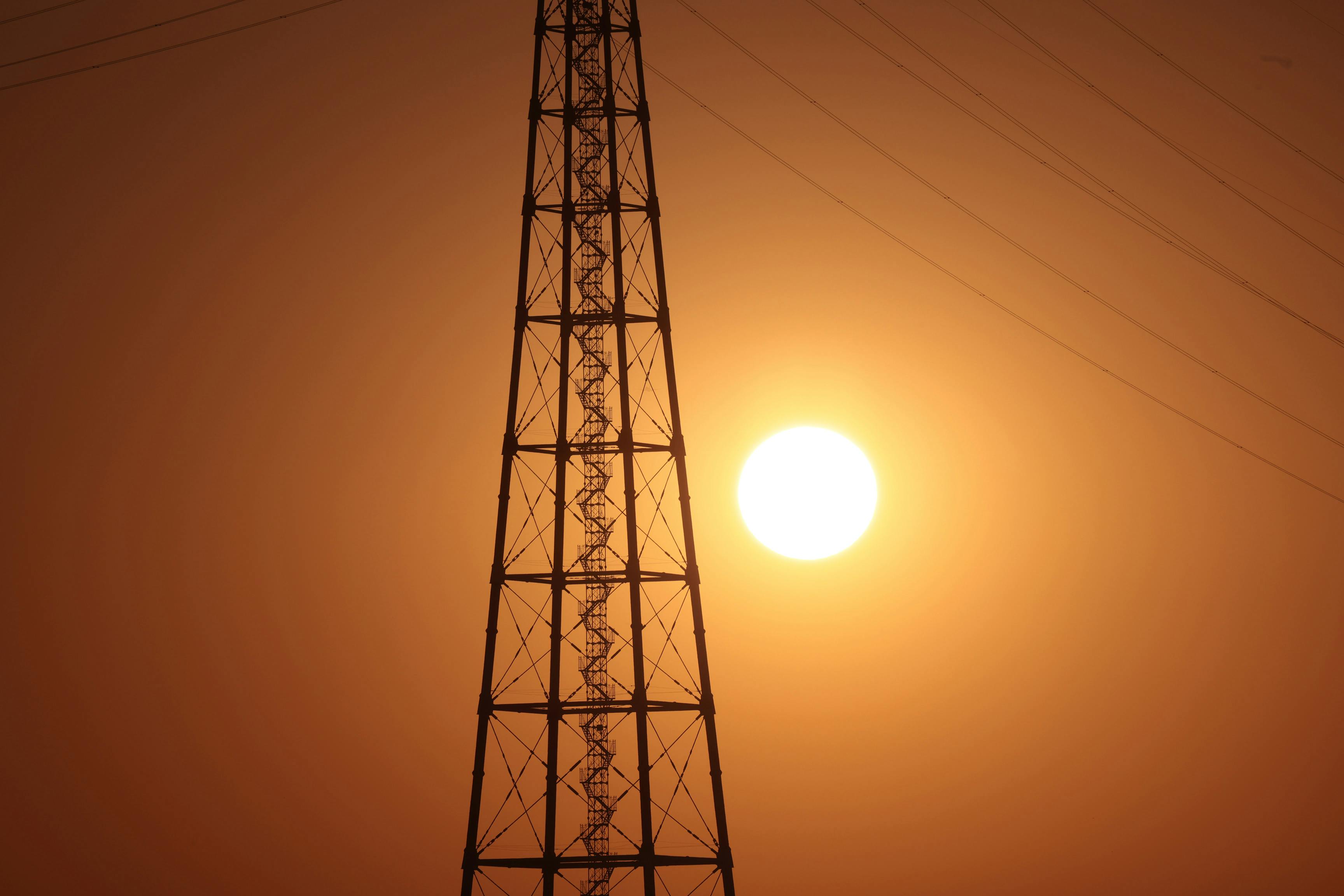 Silhouetted Utility Pole at Sunset · Free Stock Photo