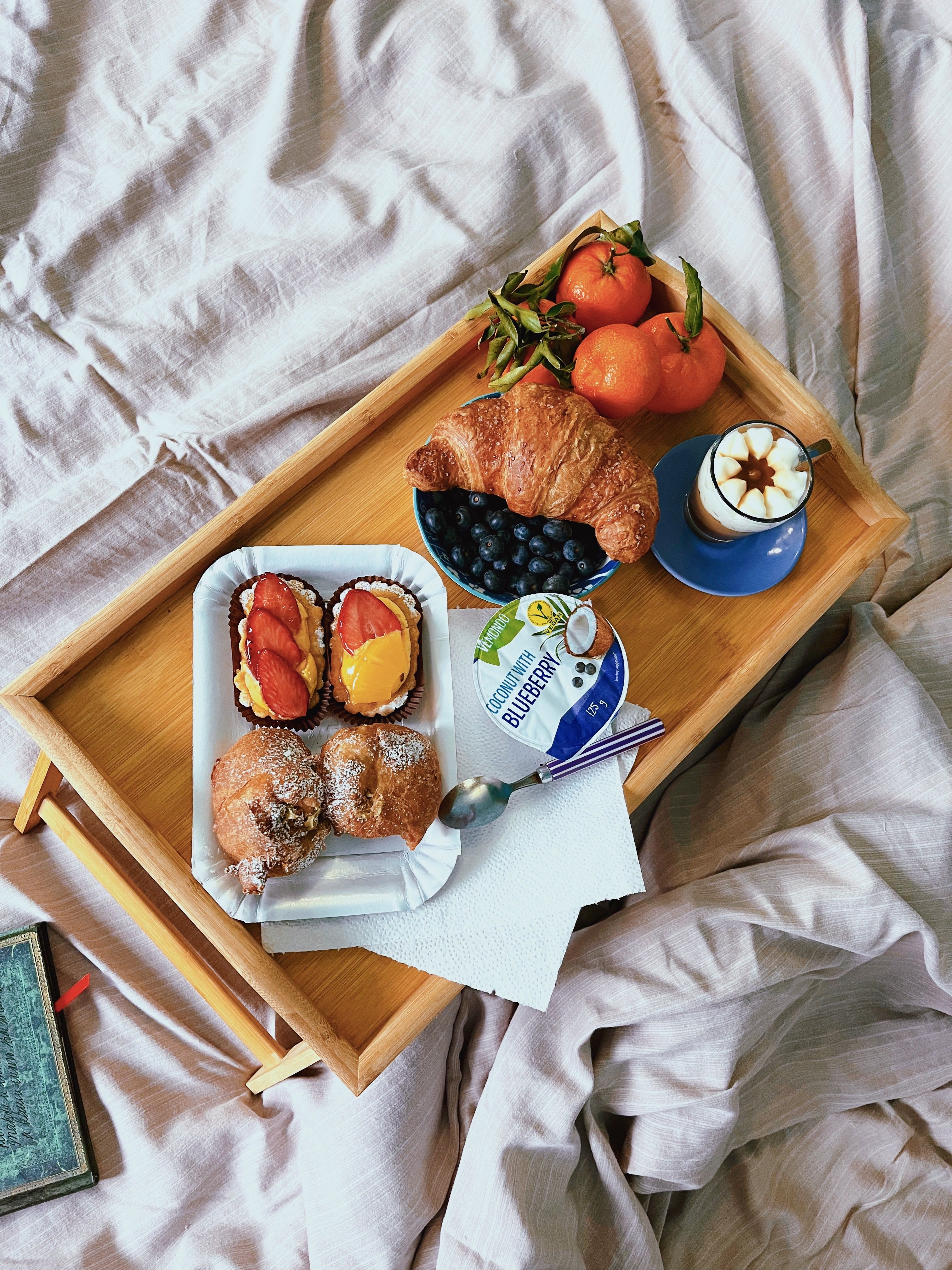 Couple Eating Breakfast on the Bed · Free Stock Photo