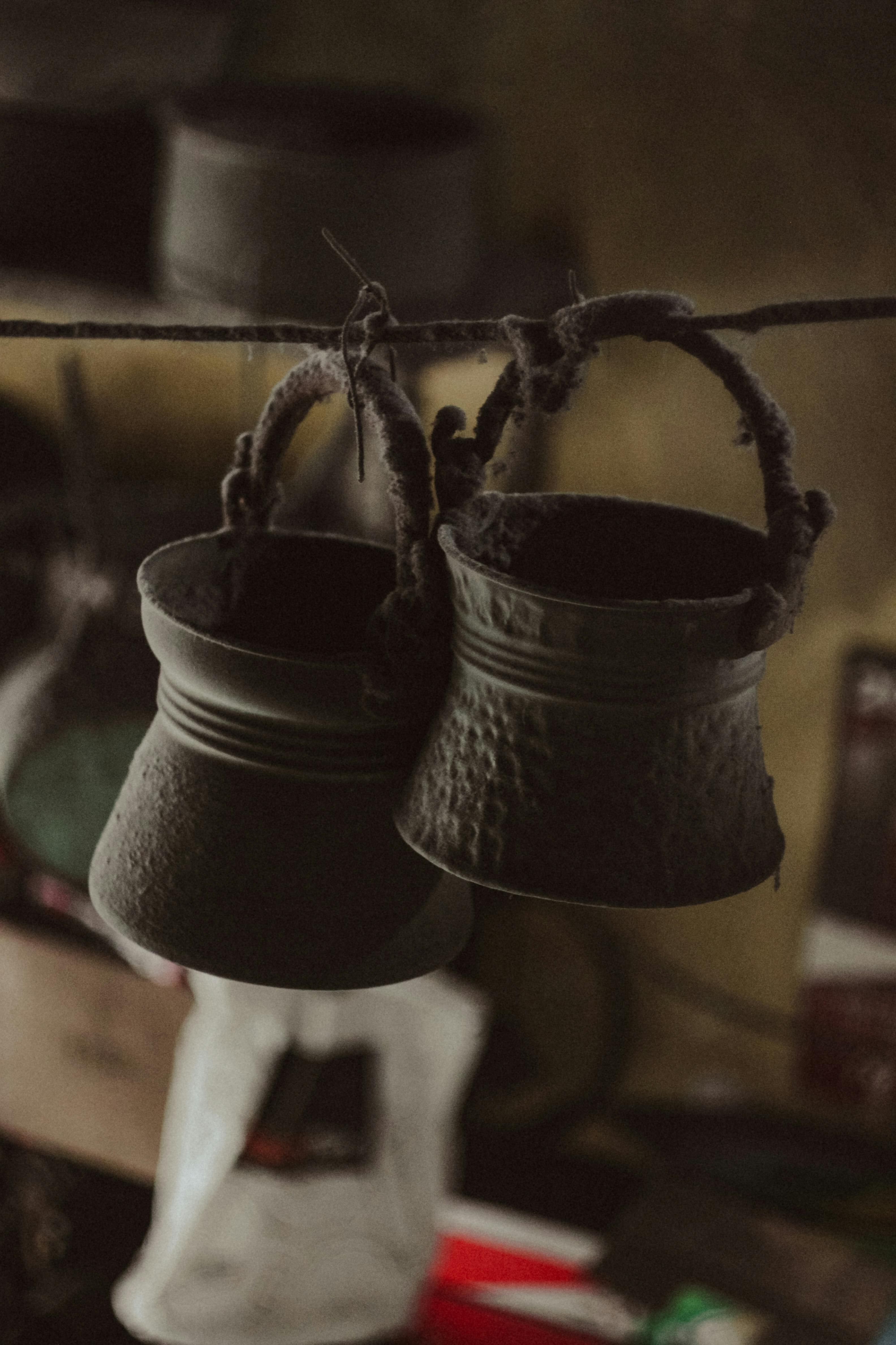 Traditional Metal Containers Hanging on a String · Free Stock Photo