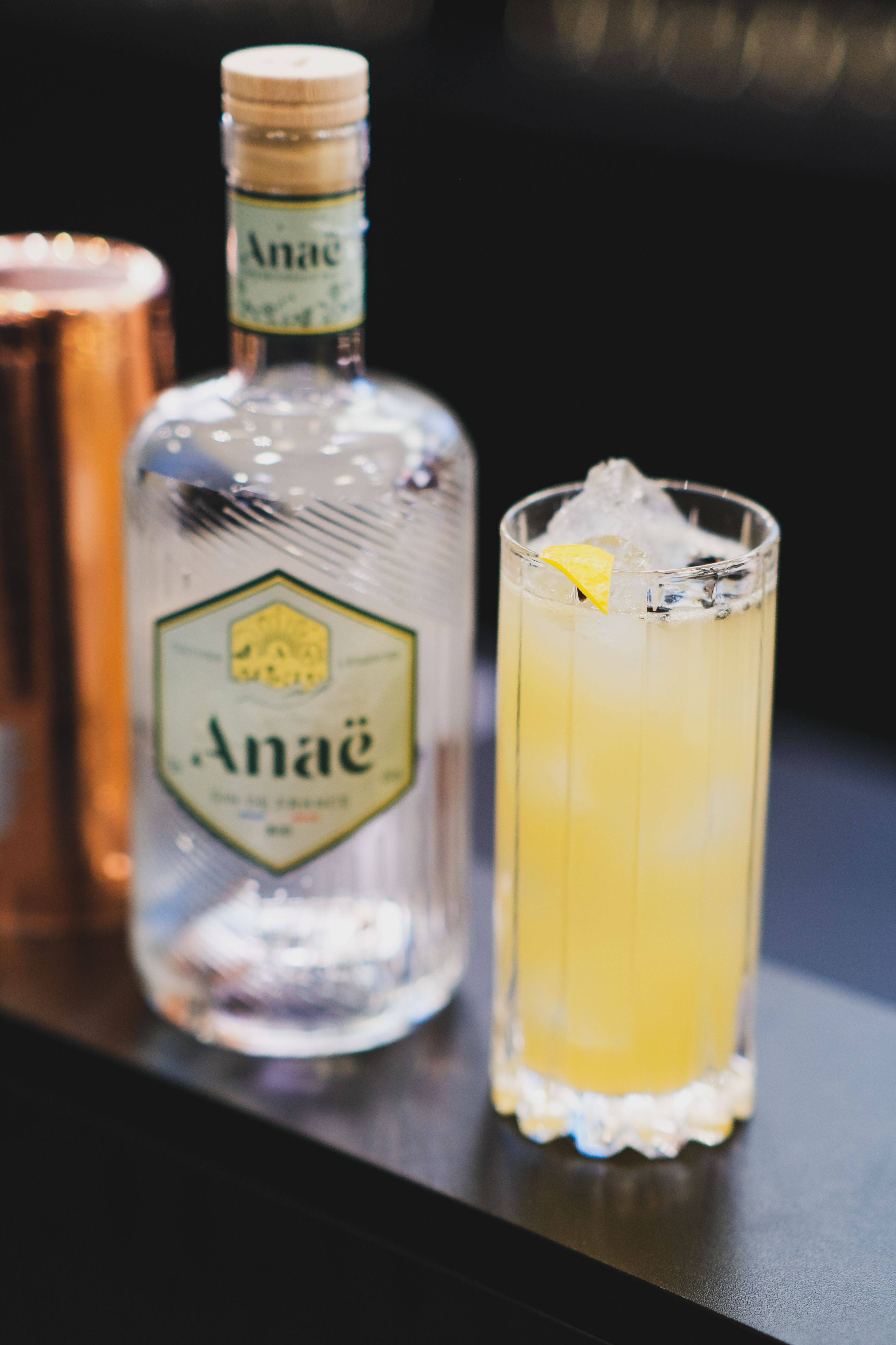 Bottle of Gin and Yellow Drink on Counter · Free Stock Photo