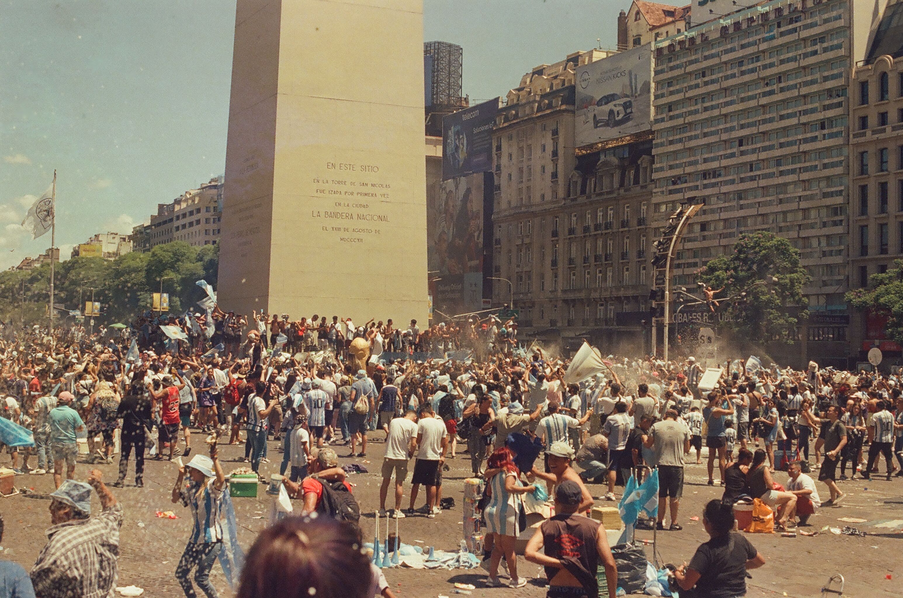 Vintage Image of a Crowd Celebrating by a Monument · Free Stock Photo