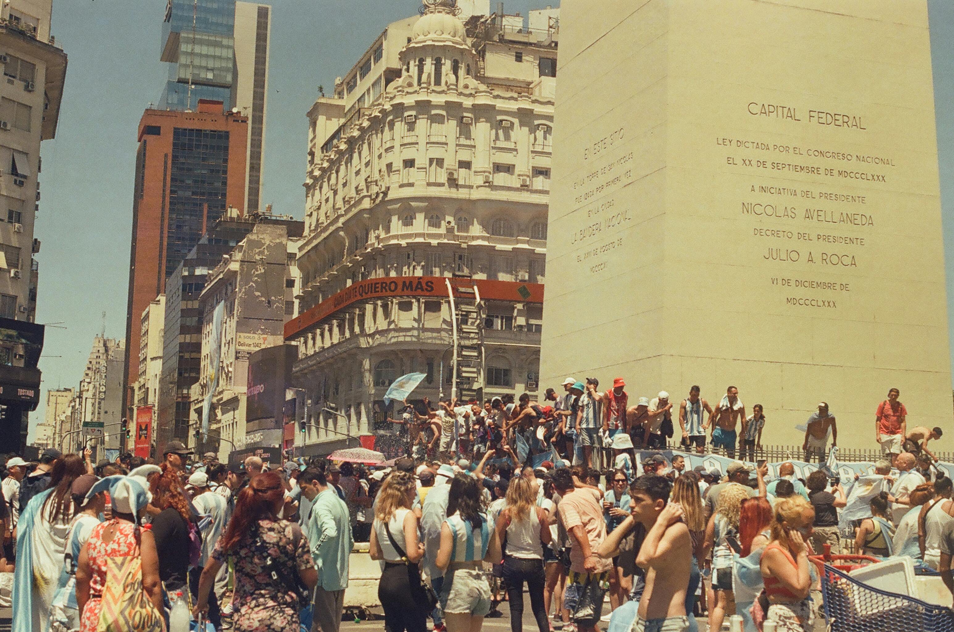 Crowd on City Street Between Buildings · Free Stock Photo