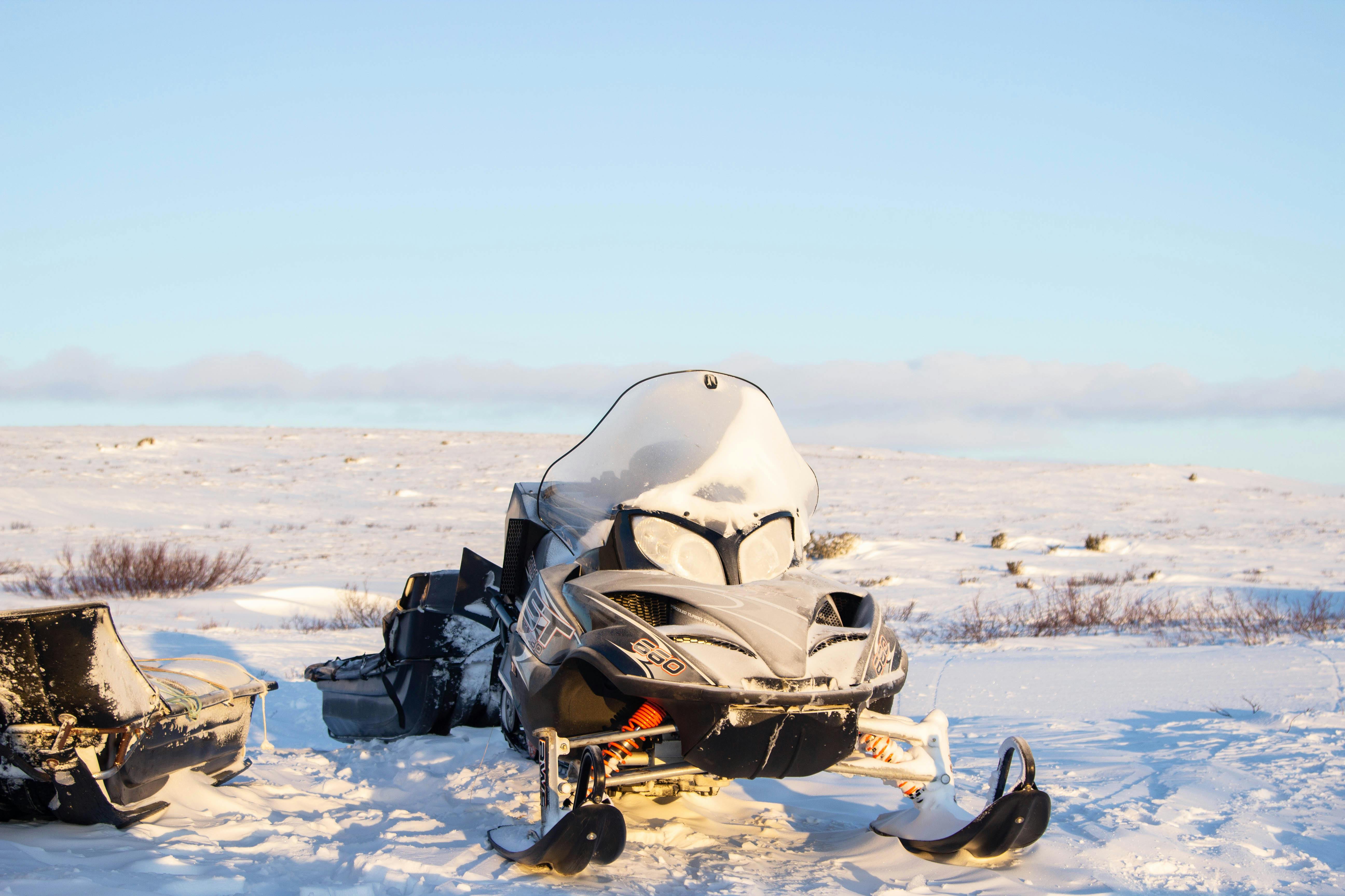 A Snowmobile on a Snowy Field · Free Stock Photo