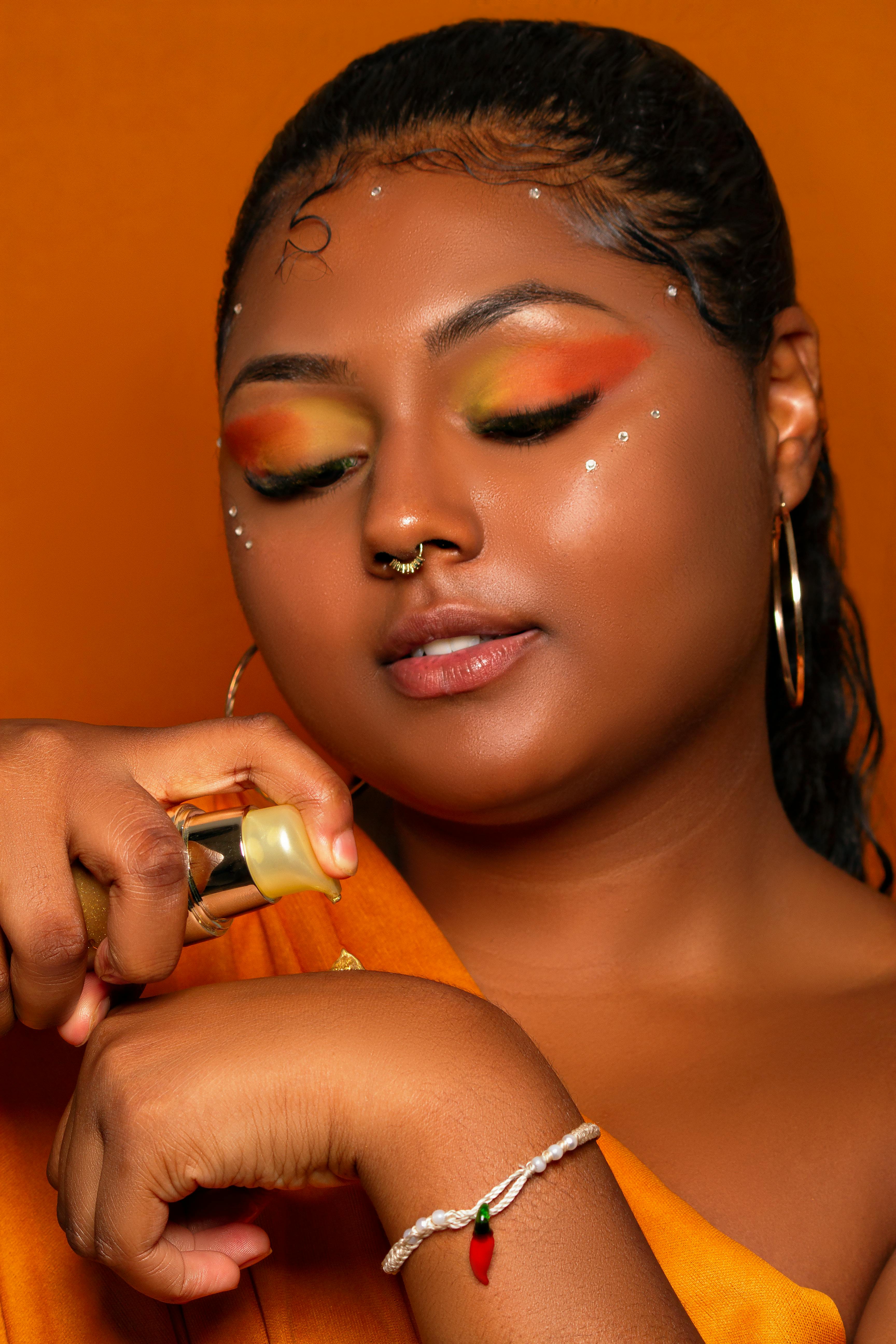 Model Presenting a Beauty Product · Free Stock Photo