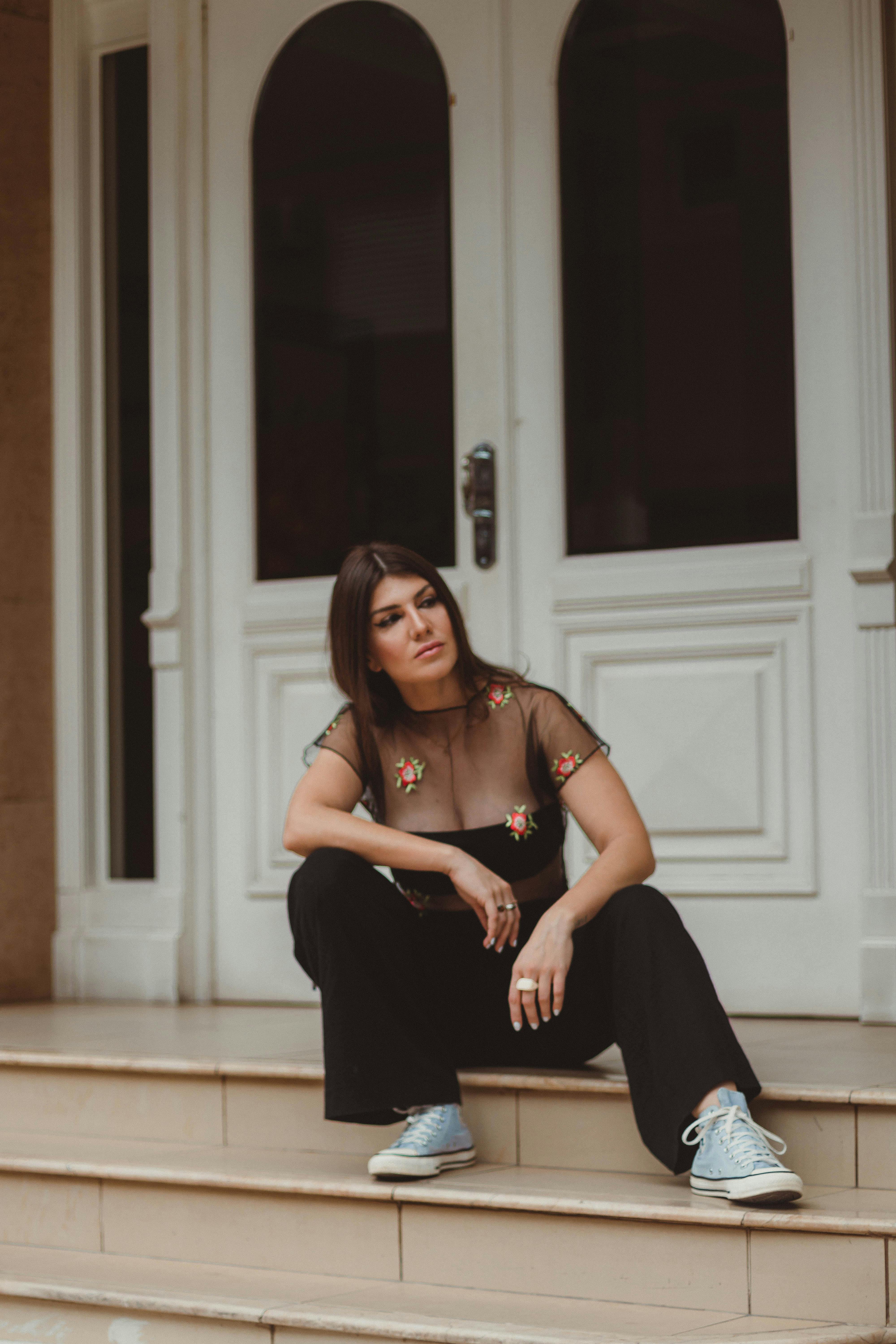 Woman in Lace White Top Sitting on Step by Door · Free Stock Photo