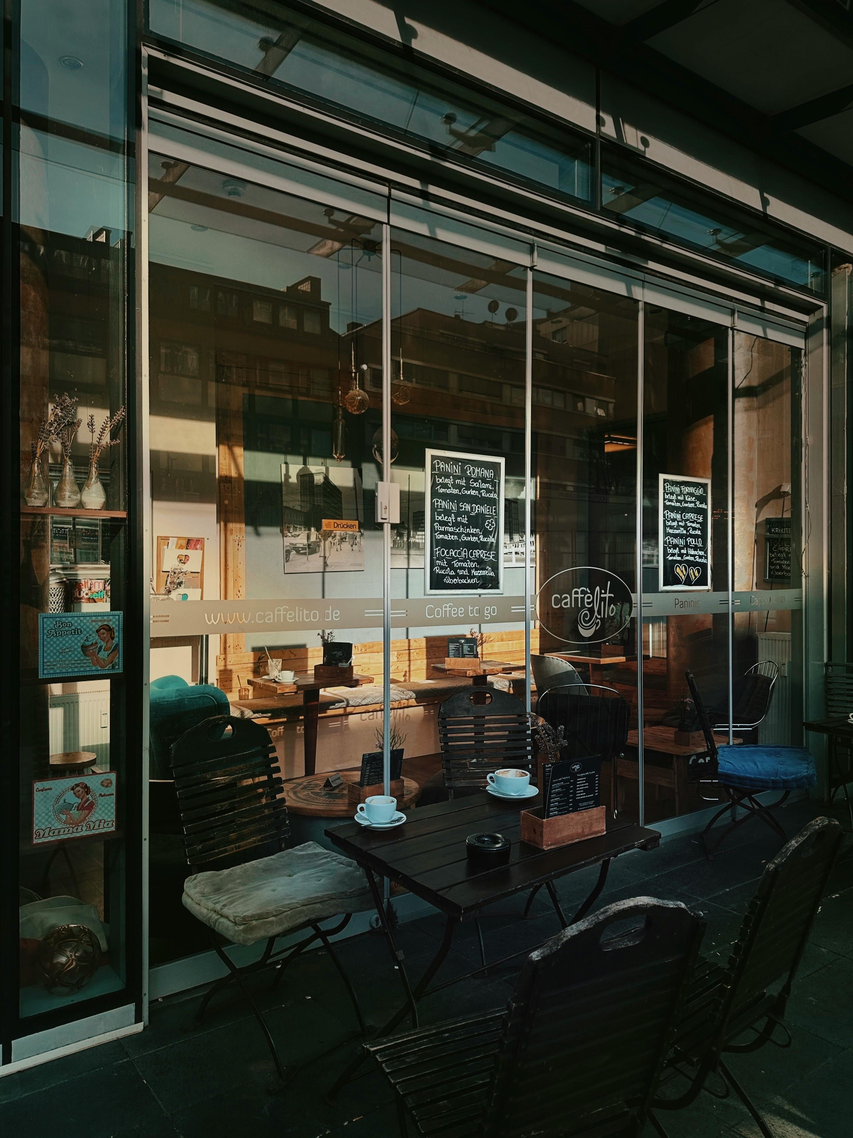 Sidewalk Cafe in a City Street · Free Stock Photo