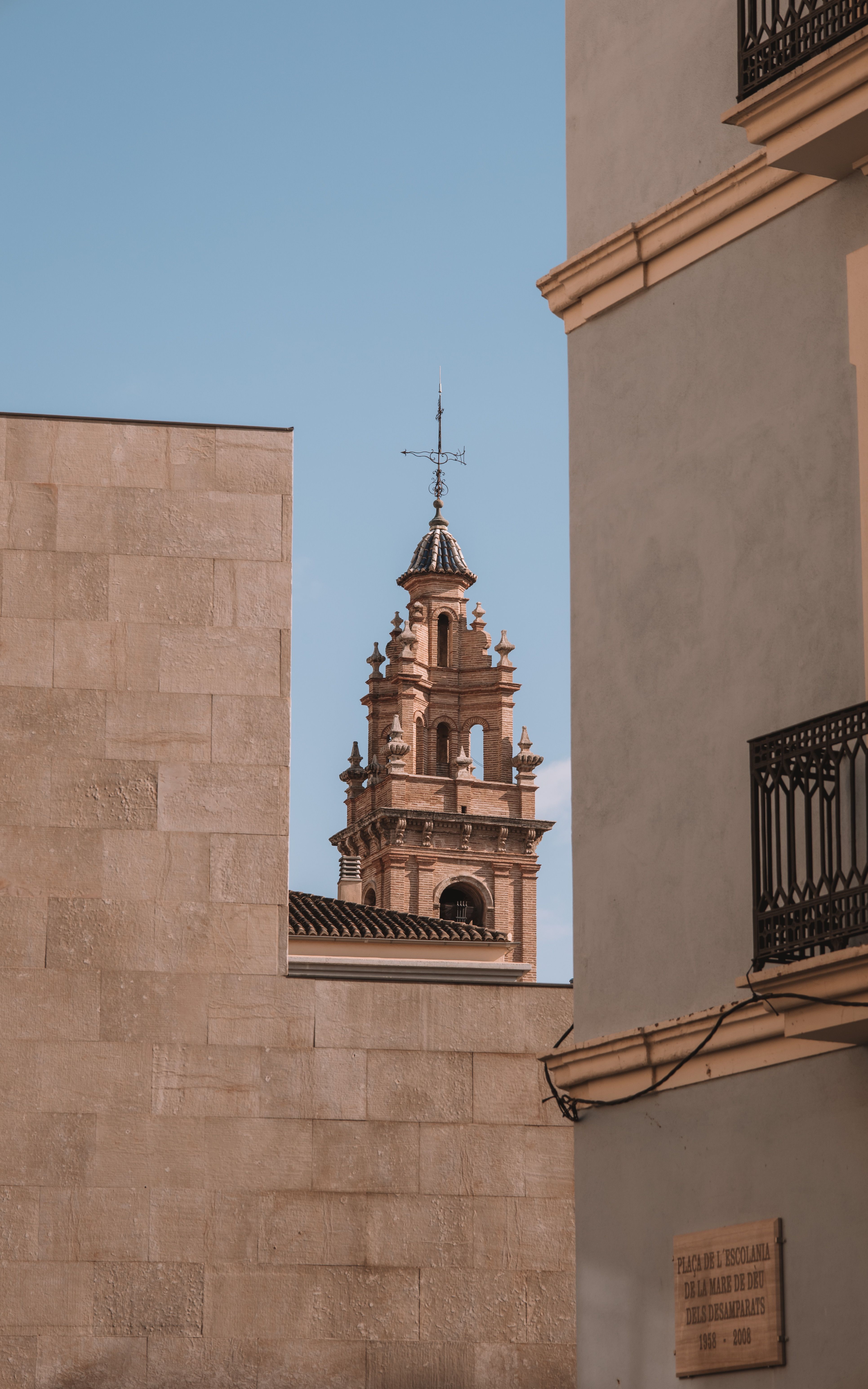 Church Tower Between Walls · Free Stock Photo