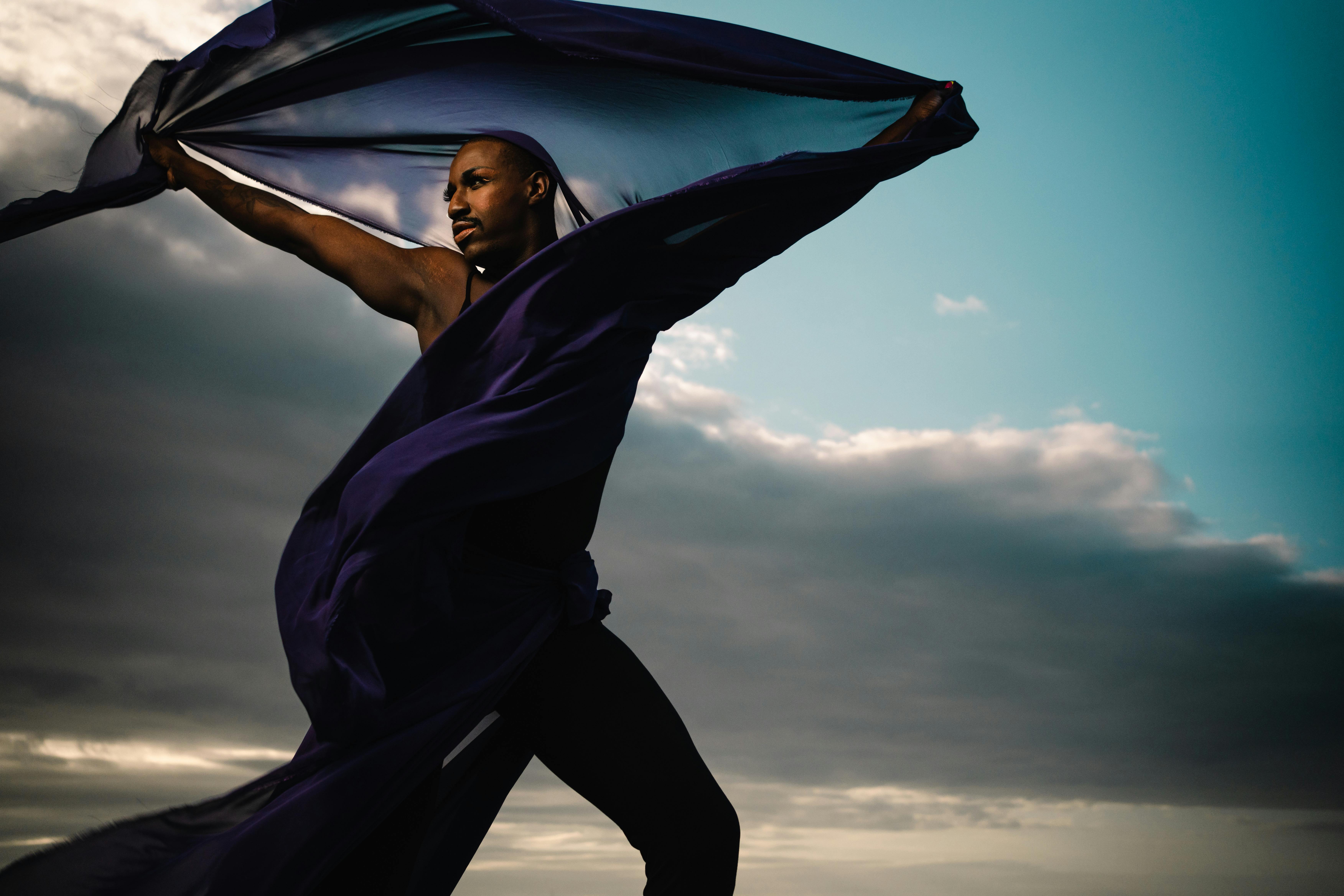 Model Posing with Scarf against Rain Cloud · Free Stock Photo