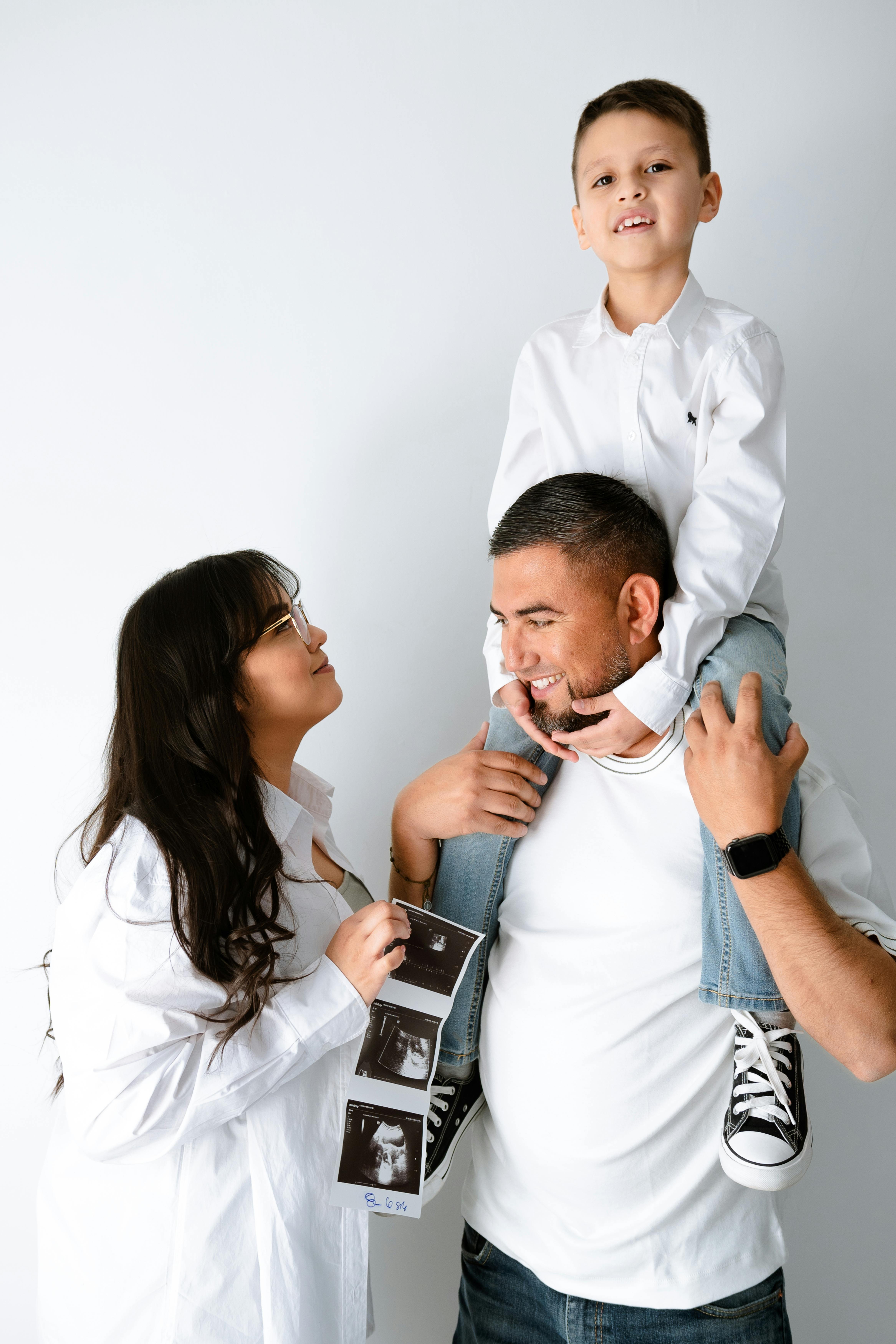 Happy Family with Ultrasound · Free Stock Photo