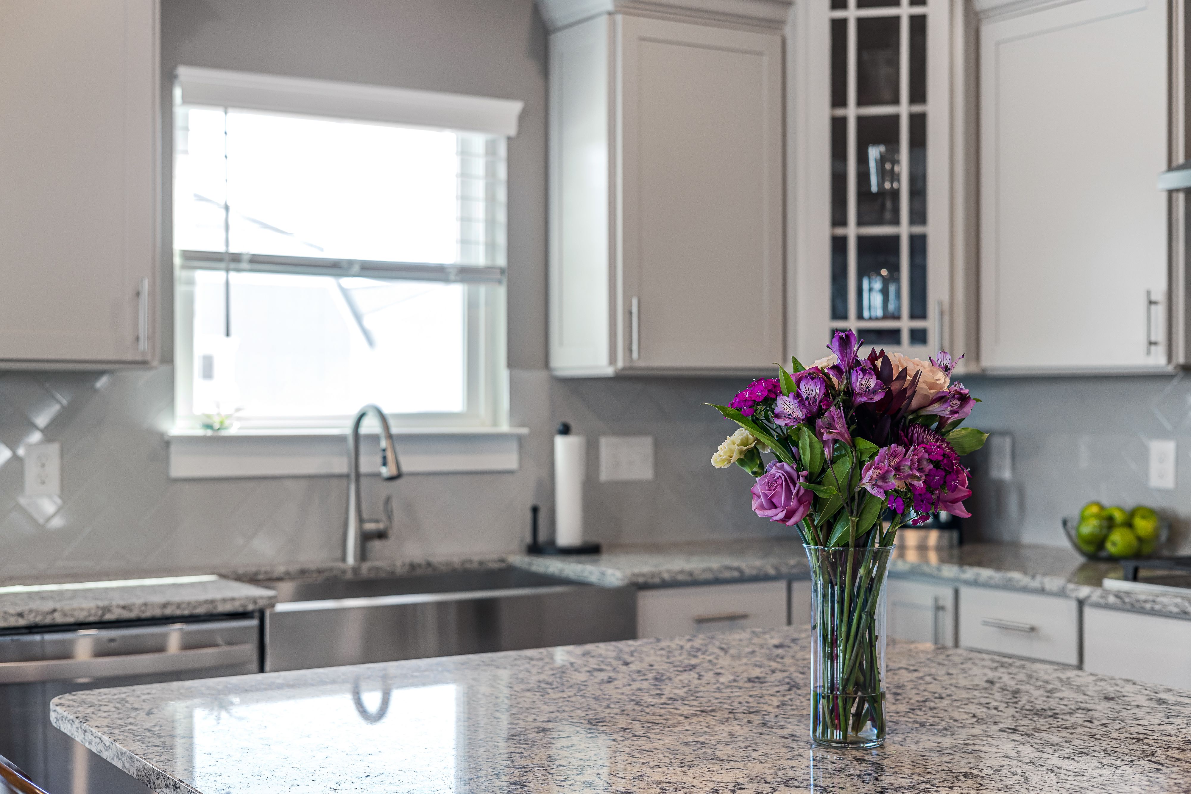 Vase with Flowers Standing on Kitchen Island · Free Stock Photo