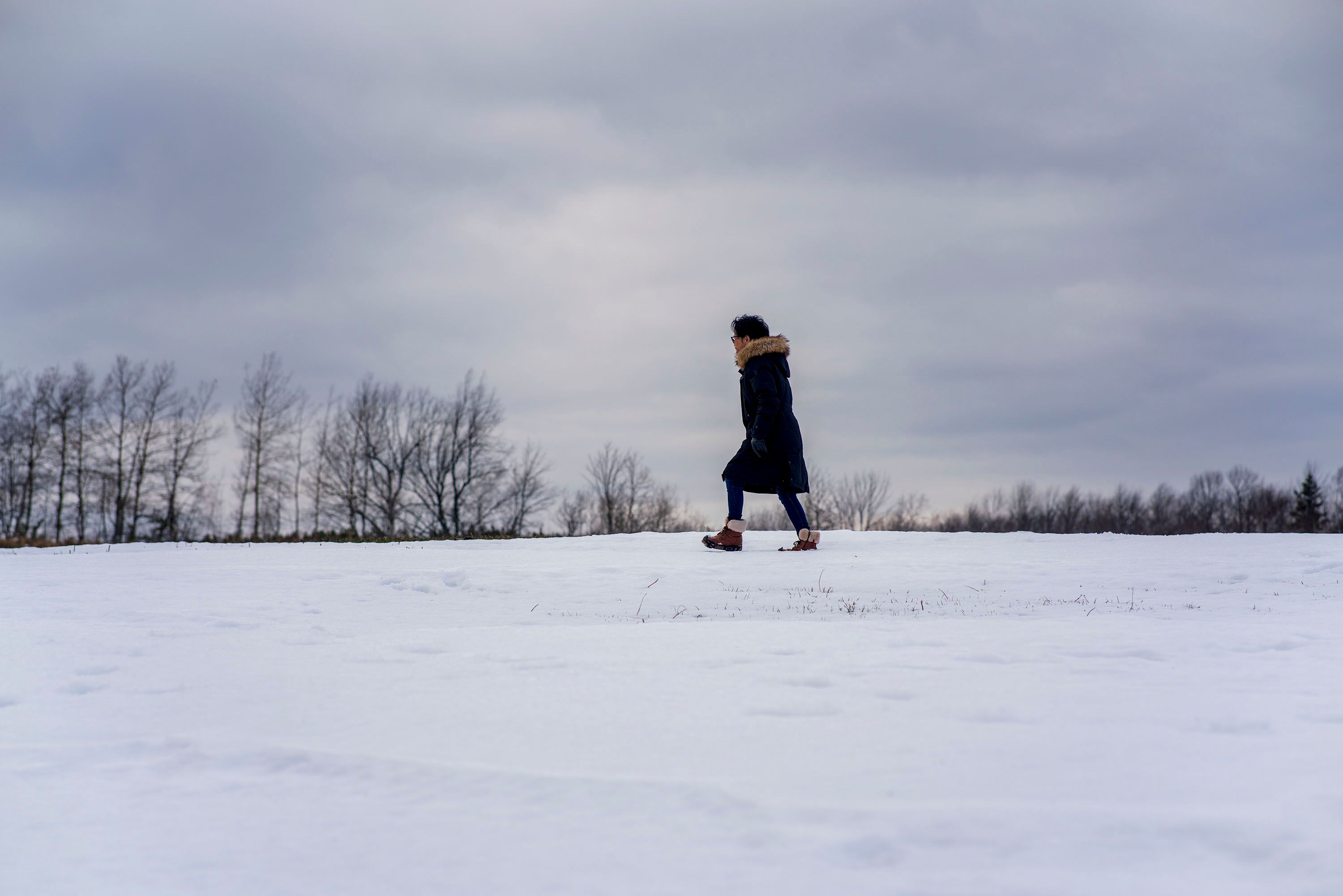 Woman Walking on Snow · Free Stock Photo