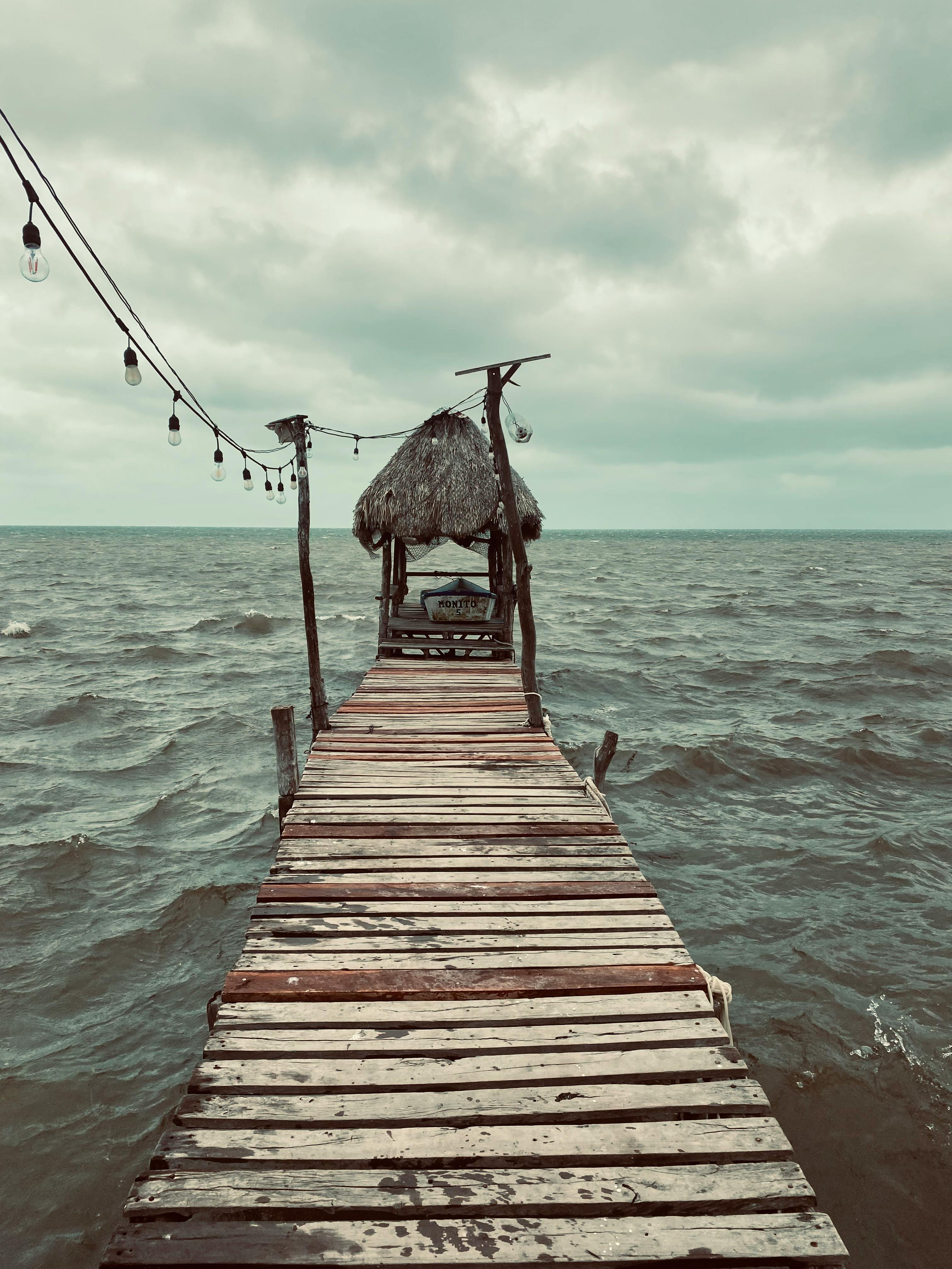 Symmetrical Picture of a Wooden Jetty on a Lake · Free Stock Photo