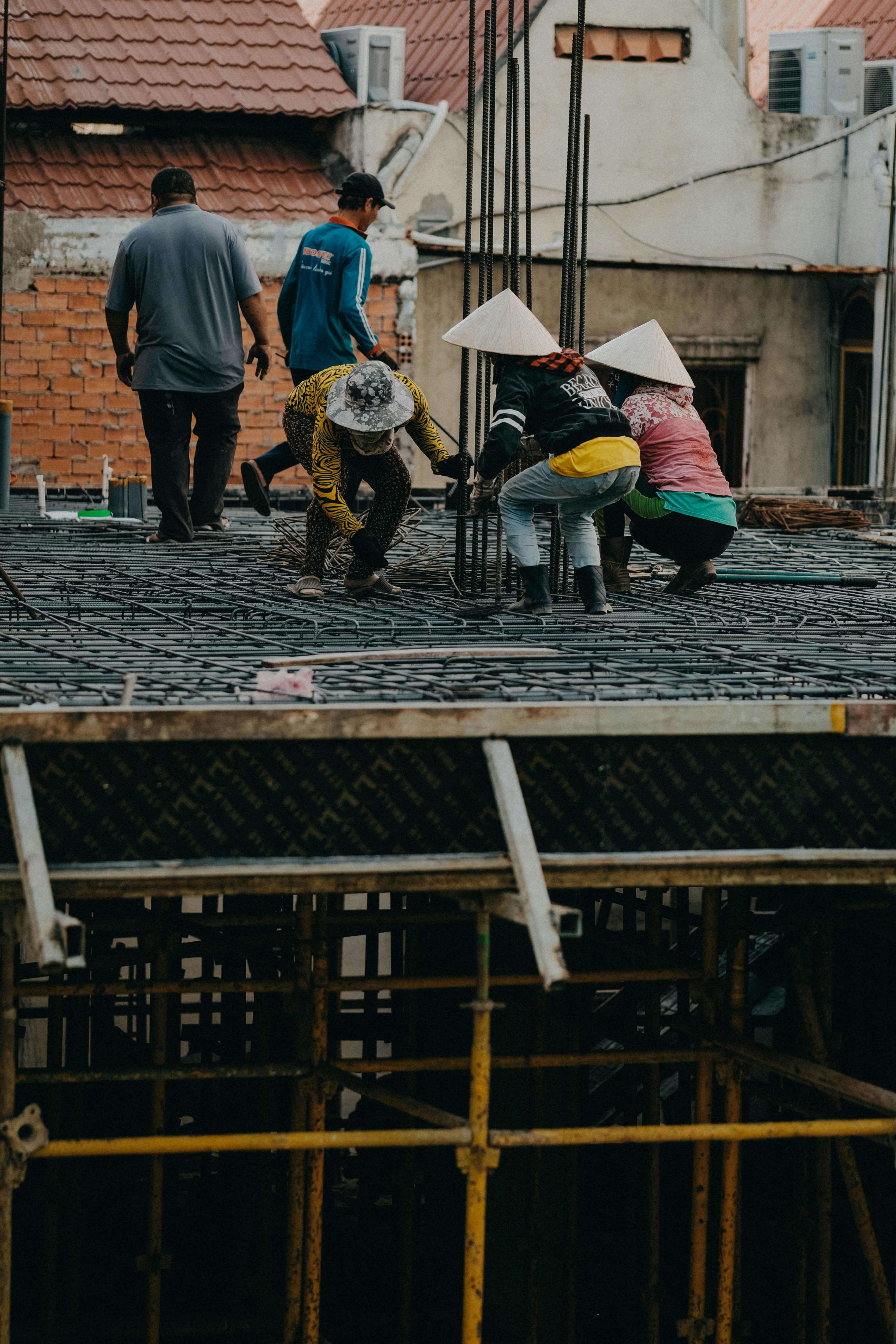 Men Doing Construction Work on Roof · Free Stock Photo