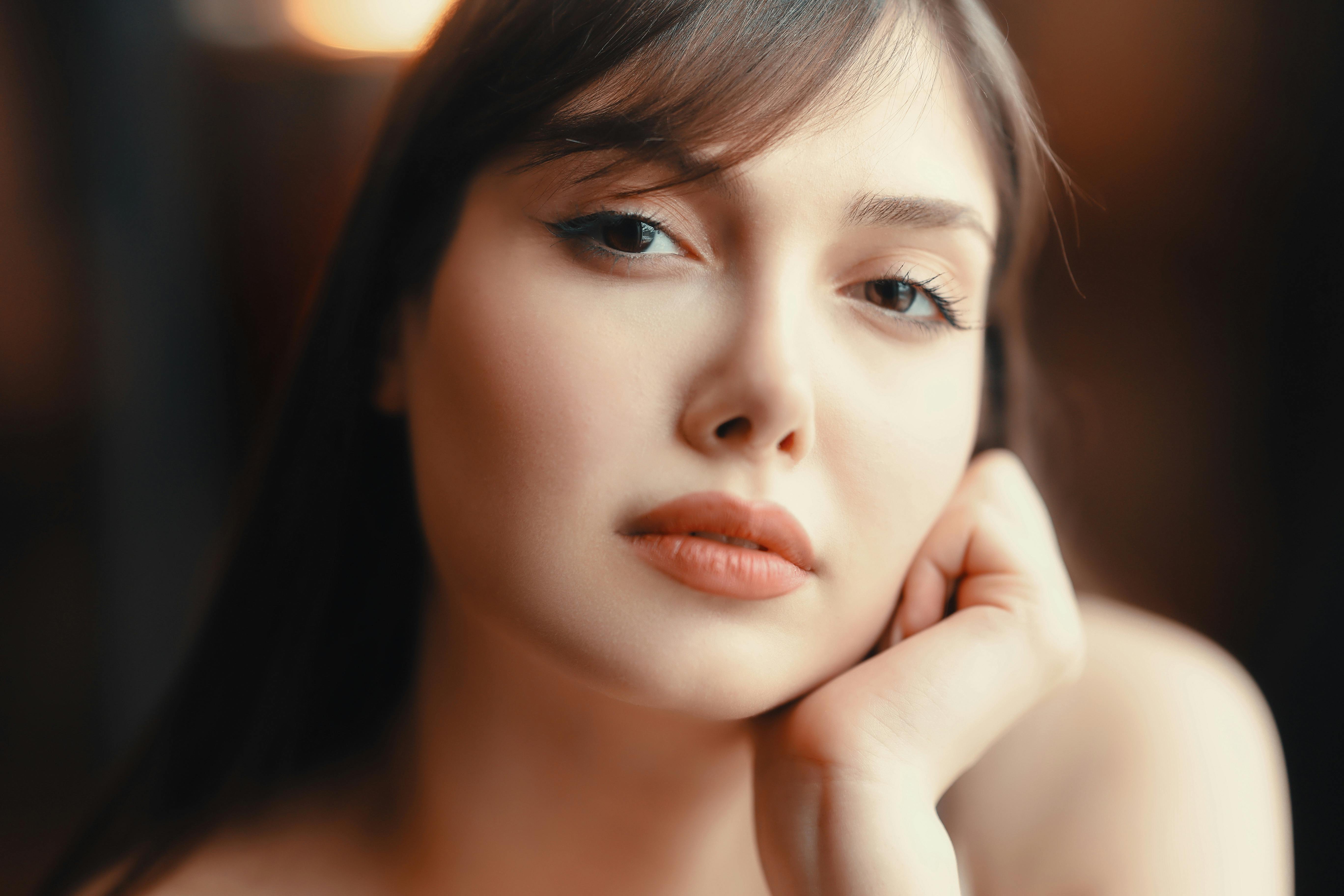 Portrait of Woman Resting Head on Hand · Free Stock Photo