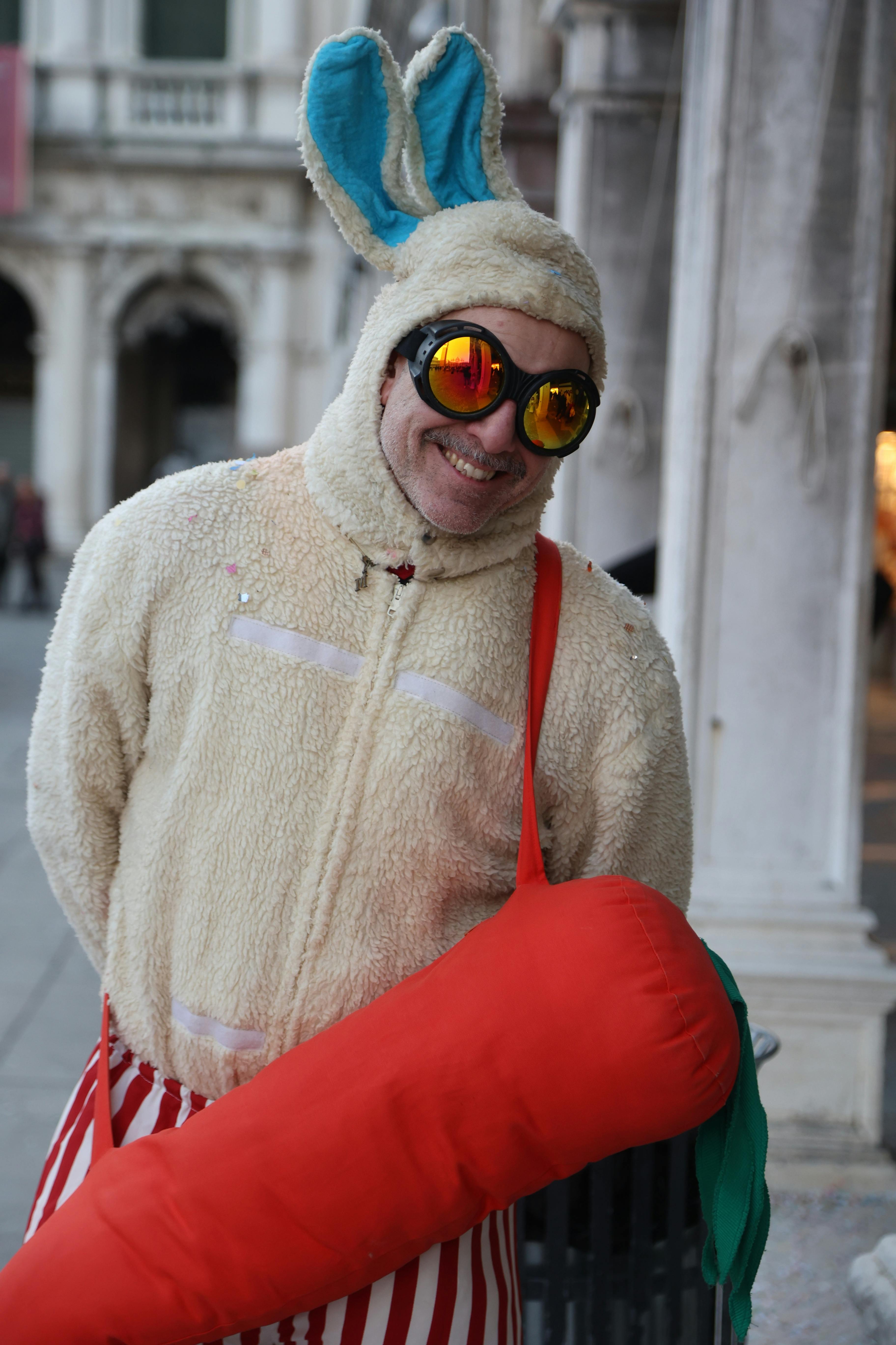 Brunette Man Posing in Red Sports Jersey and Pink Rabbit Ear Headband ...