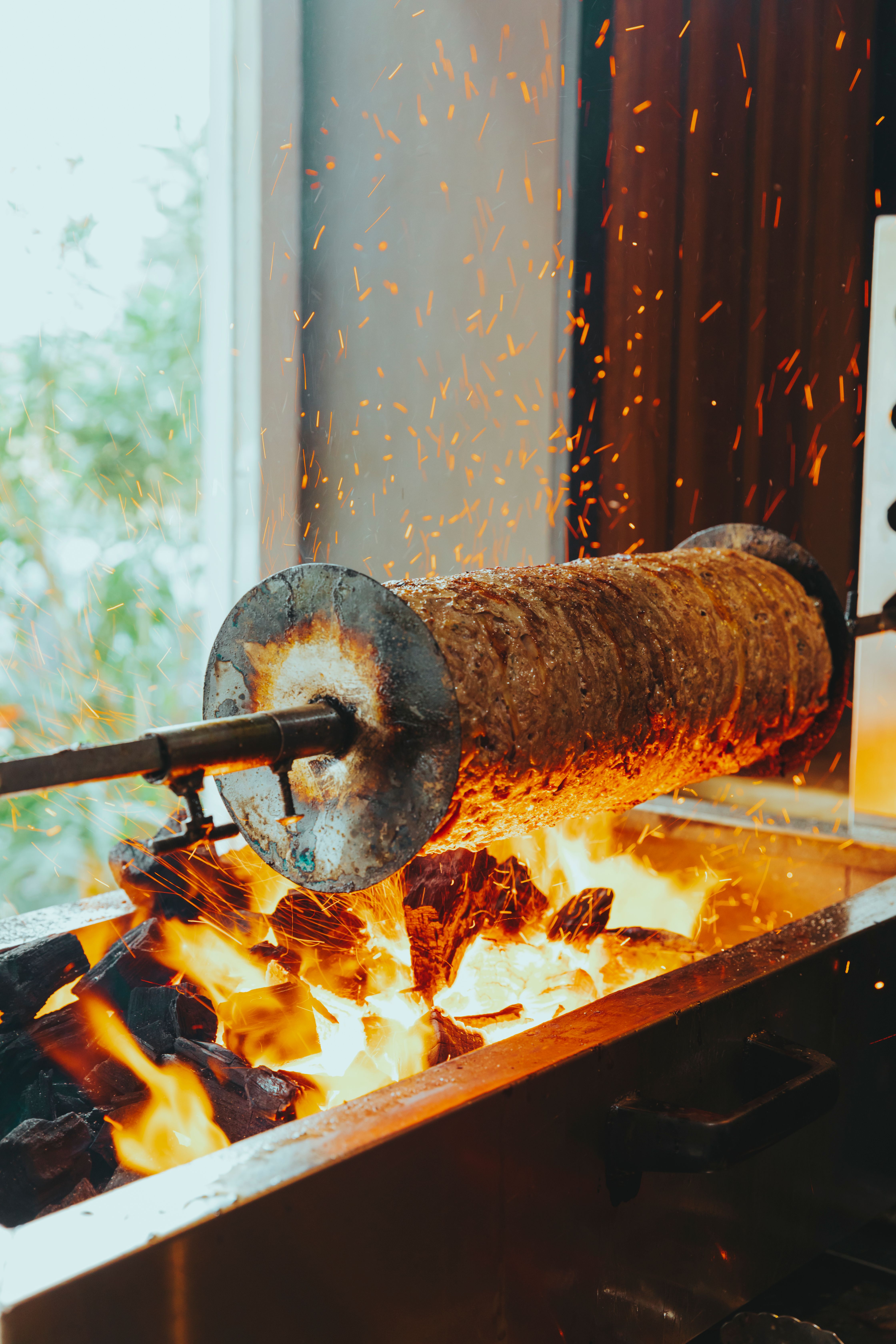 Gyros Spit-roasting Over an Open Fire · Free Stock Photo
