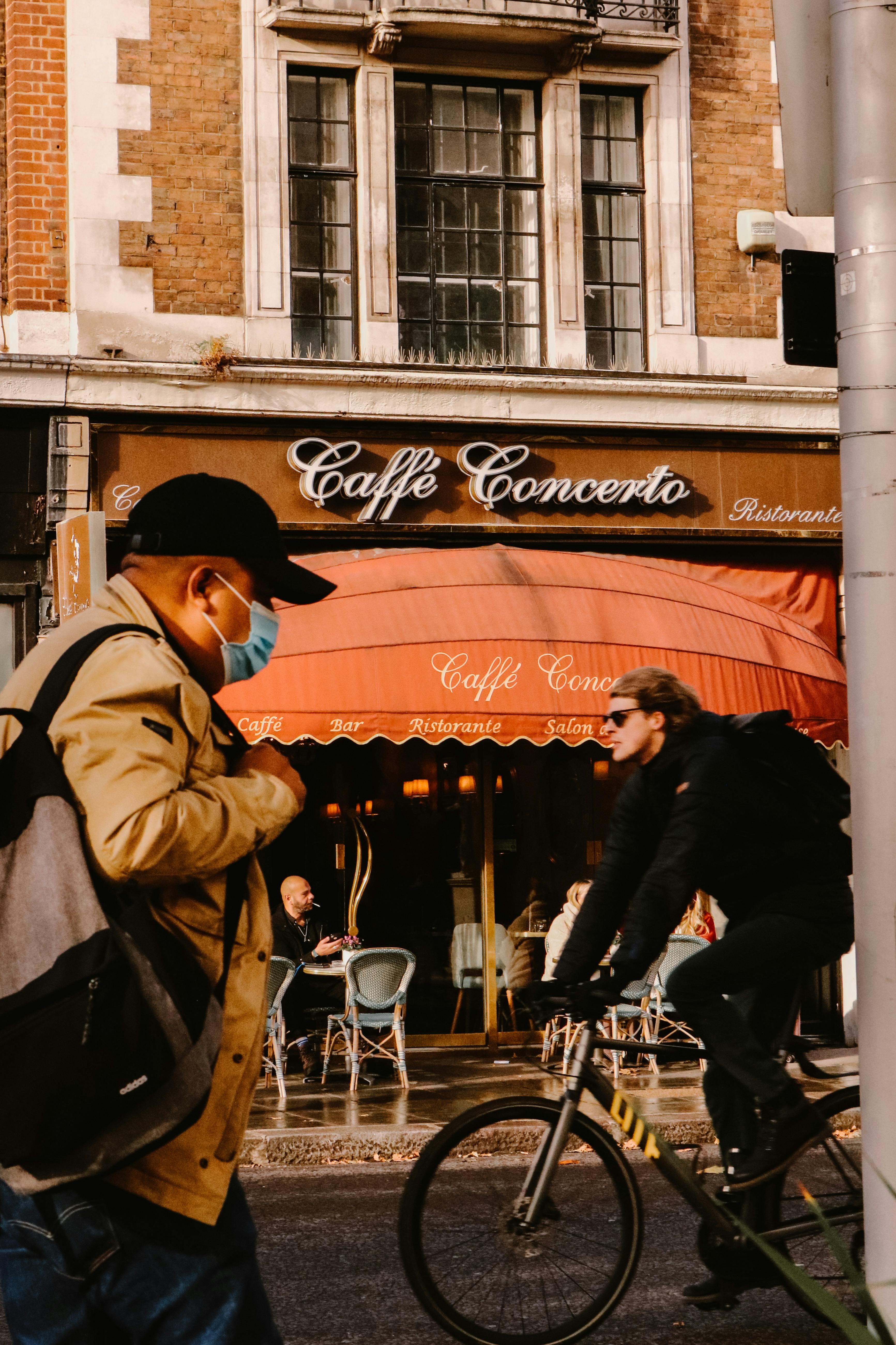 Sidewalk Cafe in a City Street · Free Stock Photo