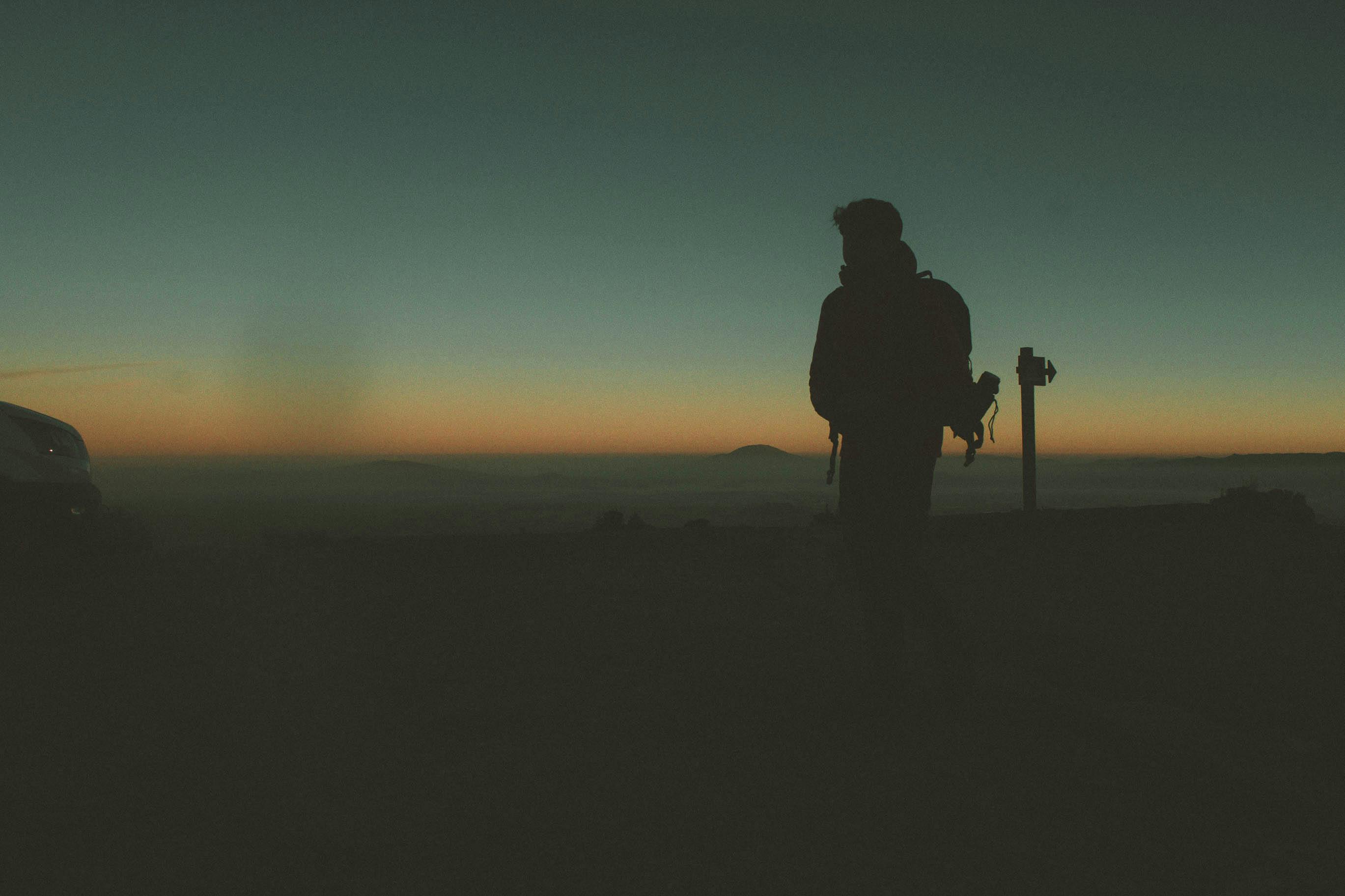 Silhouette of Man Walking in Darkness · Free Stock Photo