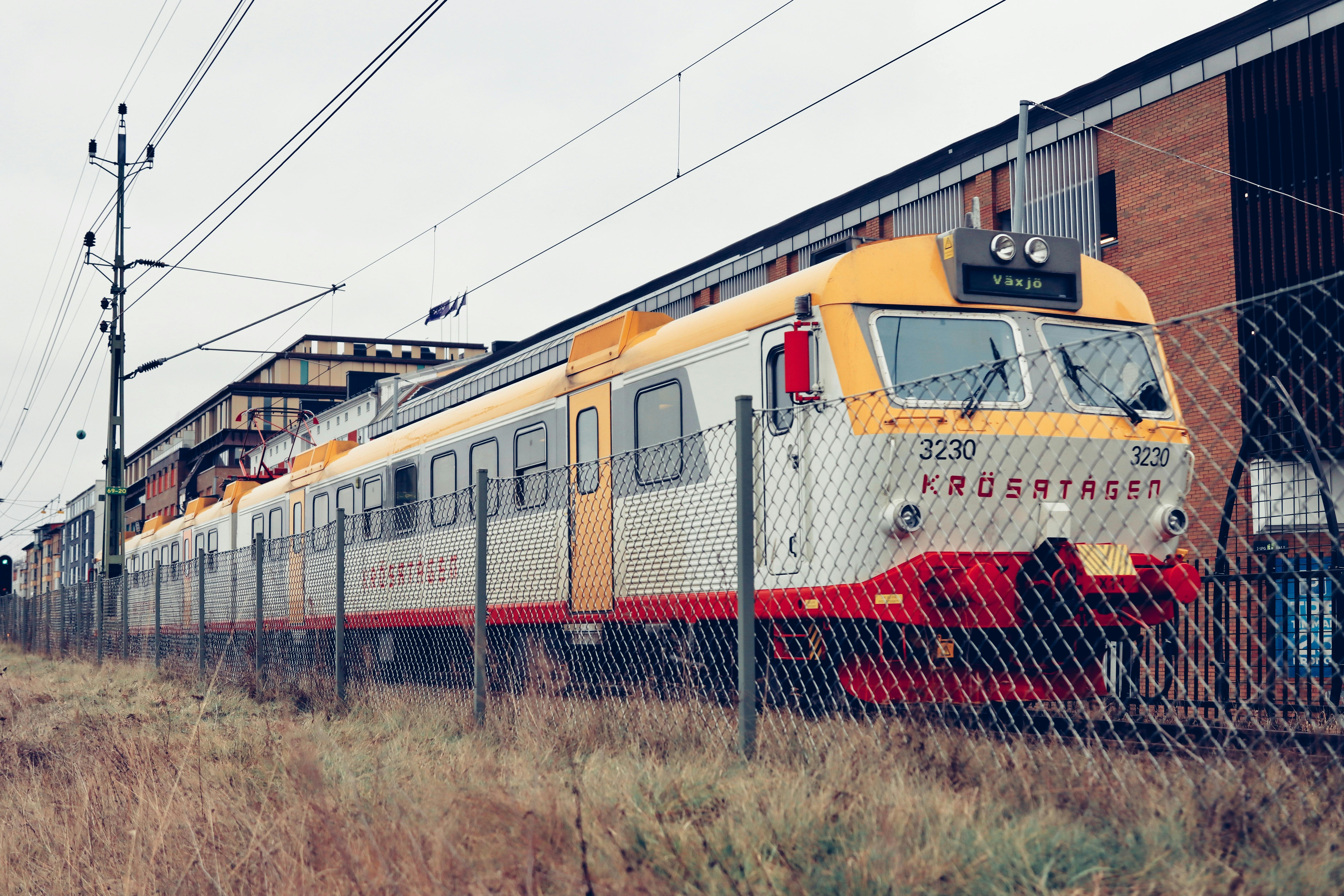 Train behind Fence · Free Stock Photo