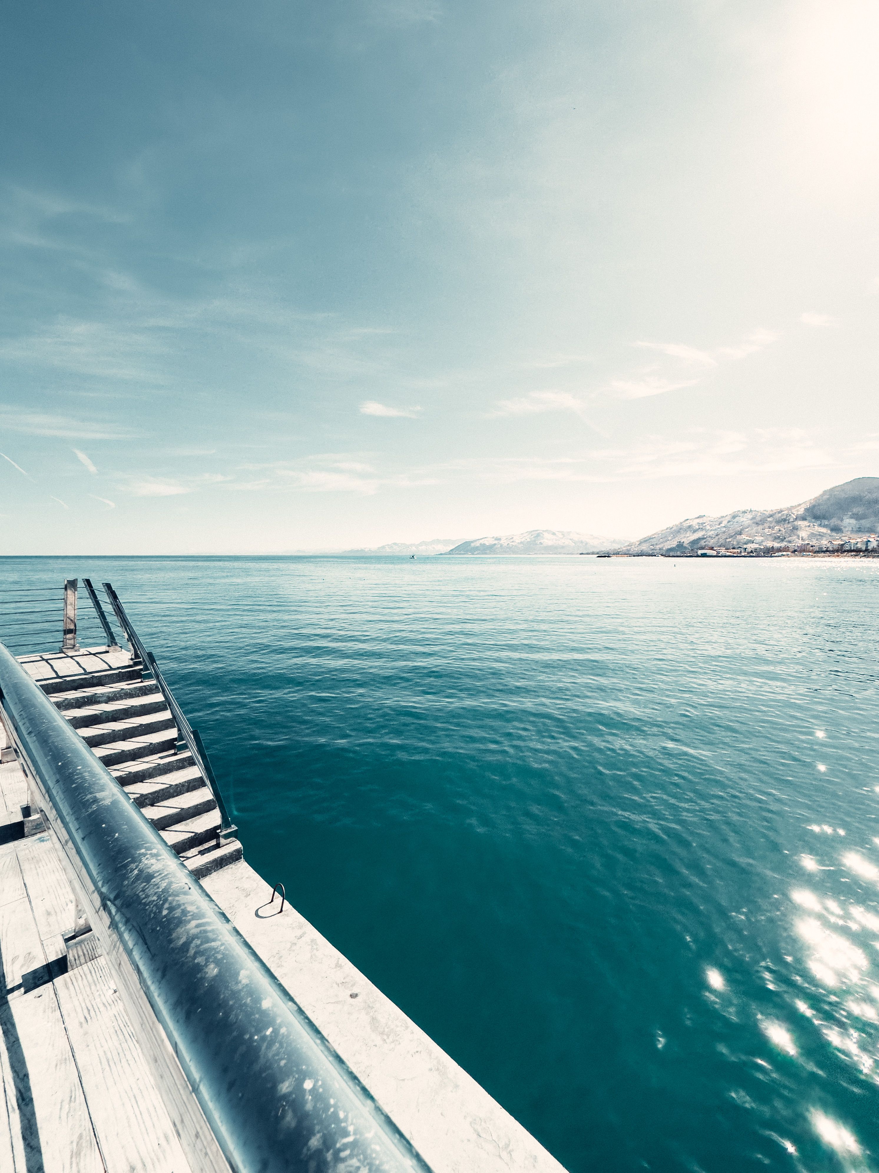Sunlight over Wall and Stairs on Shore · Free Stock Photo