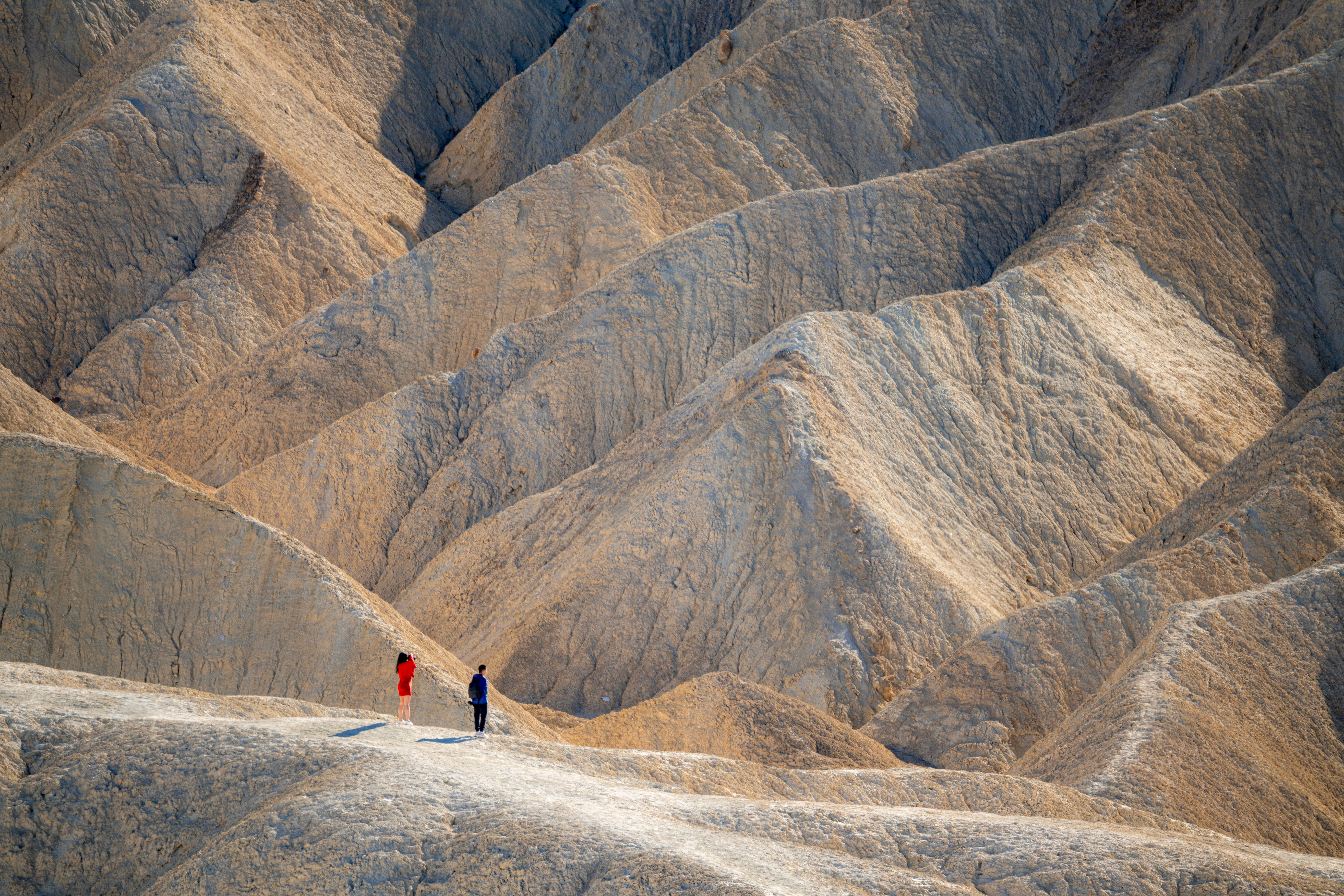 People Standing near Rock Formations · Free Stock Photo