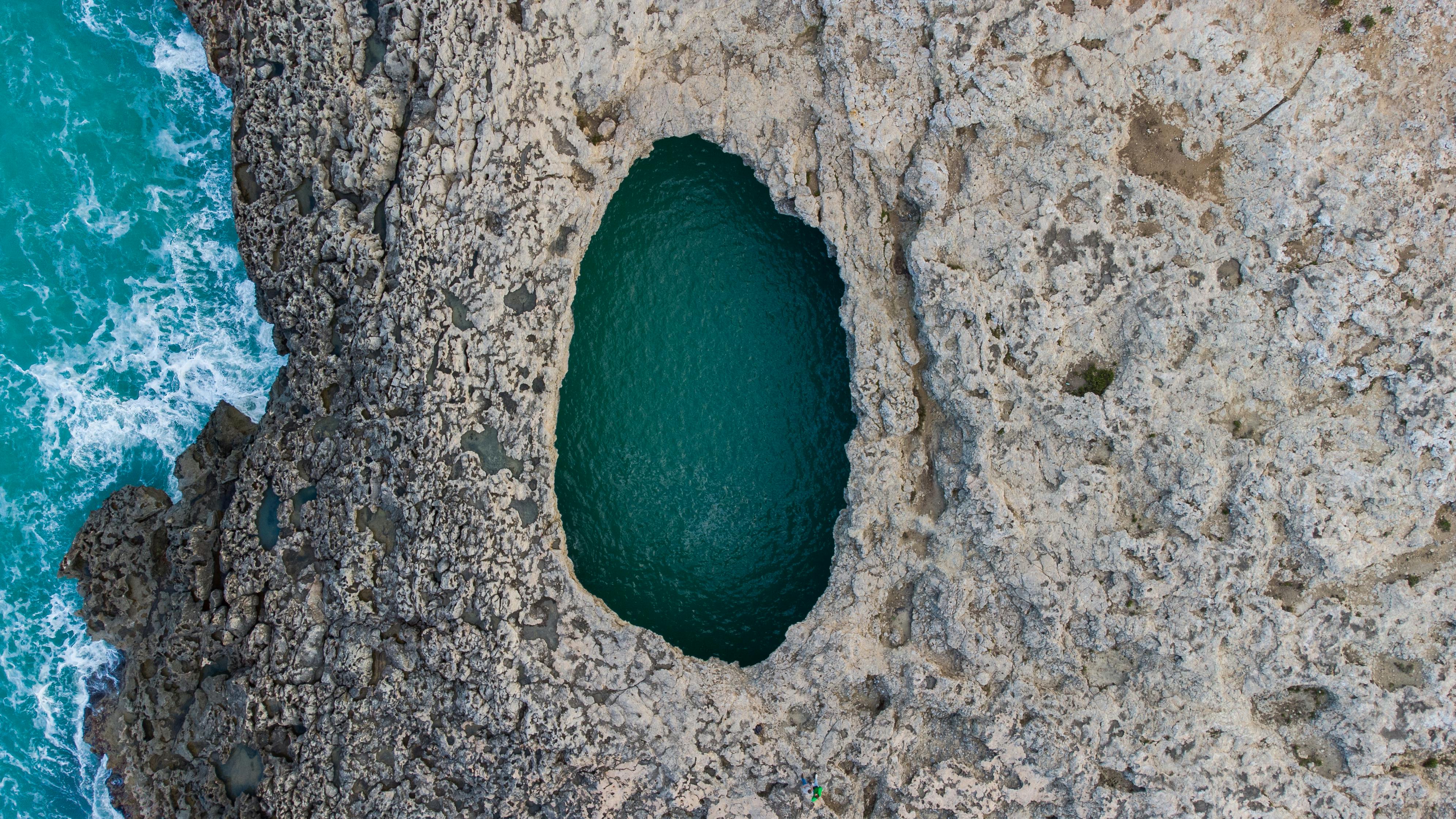 Rock Formation with Water in a Cave · Free Stock Photo