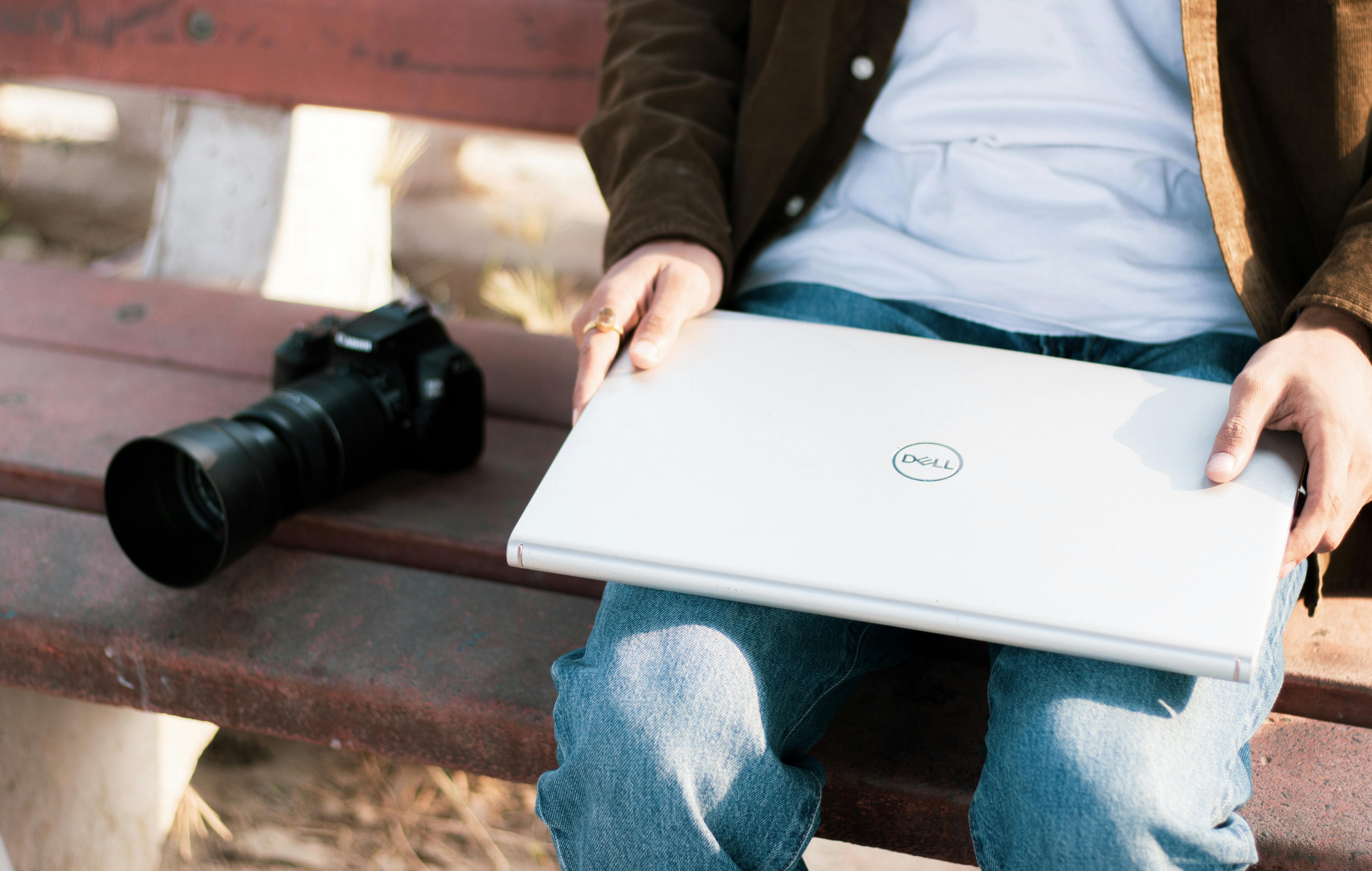 Man is holding his laptop · Free Stock Photo
