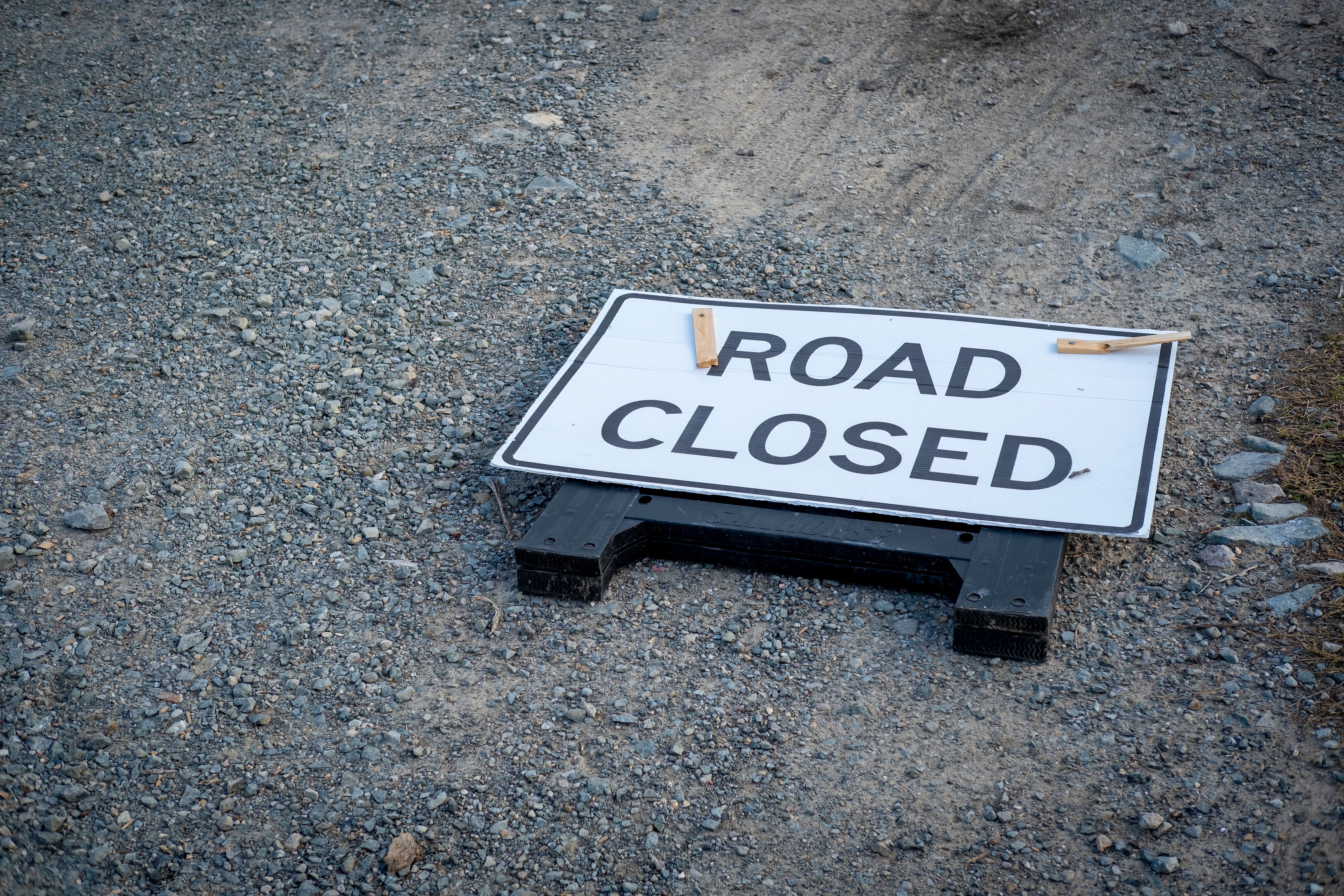 Sign Lying on the Ground · Free Stock Photo