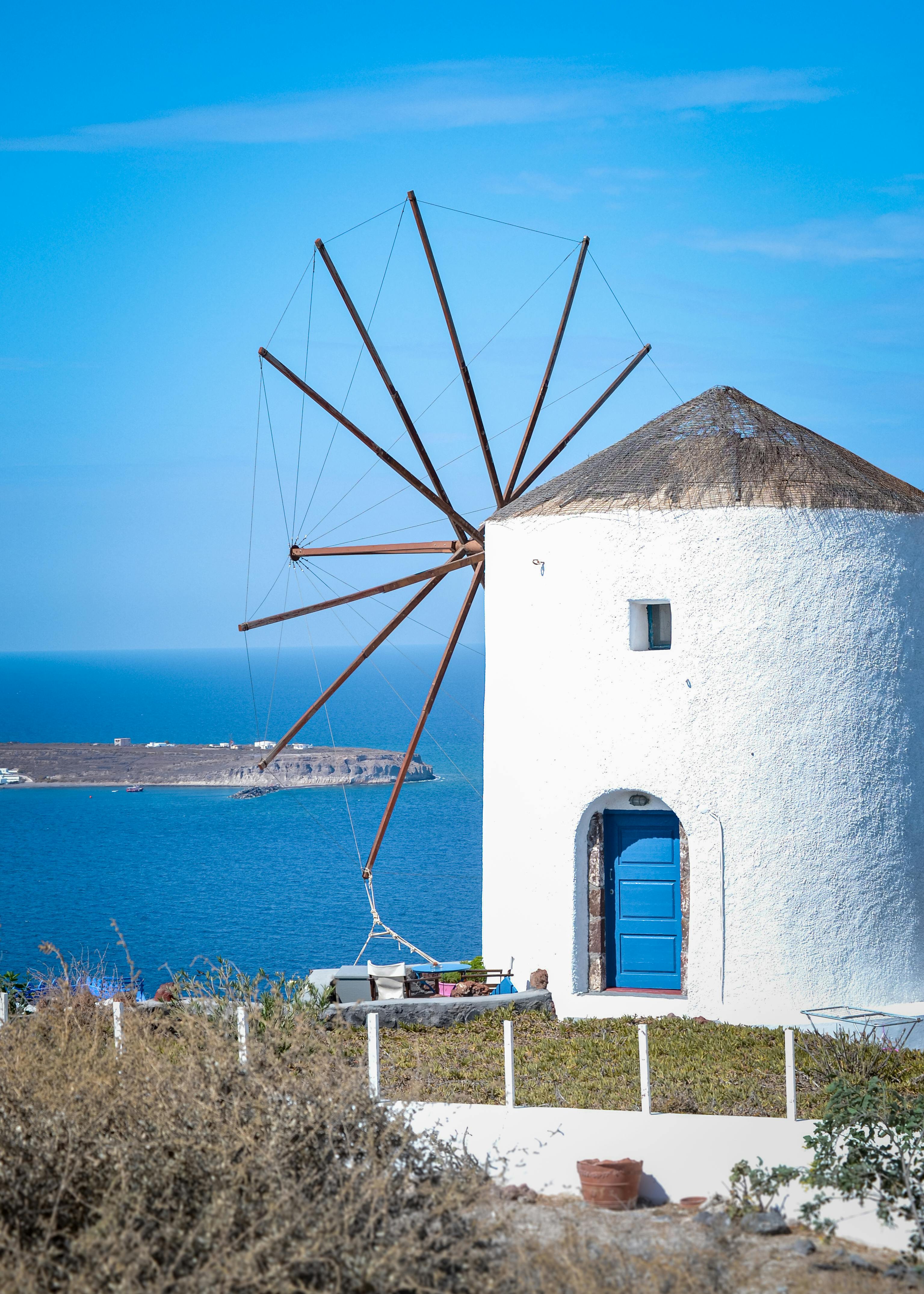Traditional Windmill with Blue Facade in Santorini · Free Stock Photo