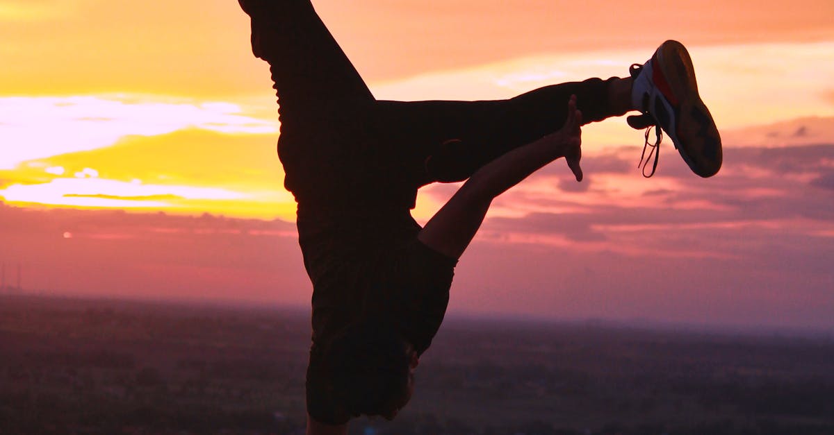 Person Doing Handstand on Hilltop at Sunset · Free Stock Photo Person Doing Handstand on Hilltop at Sunset · Free Stock Photo