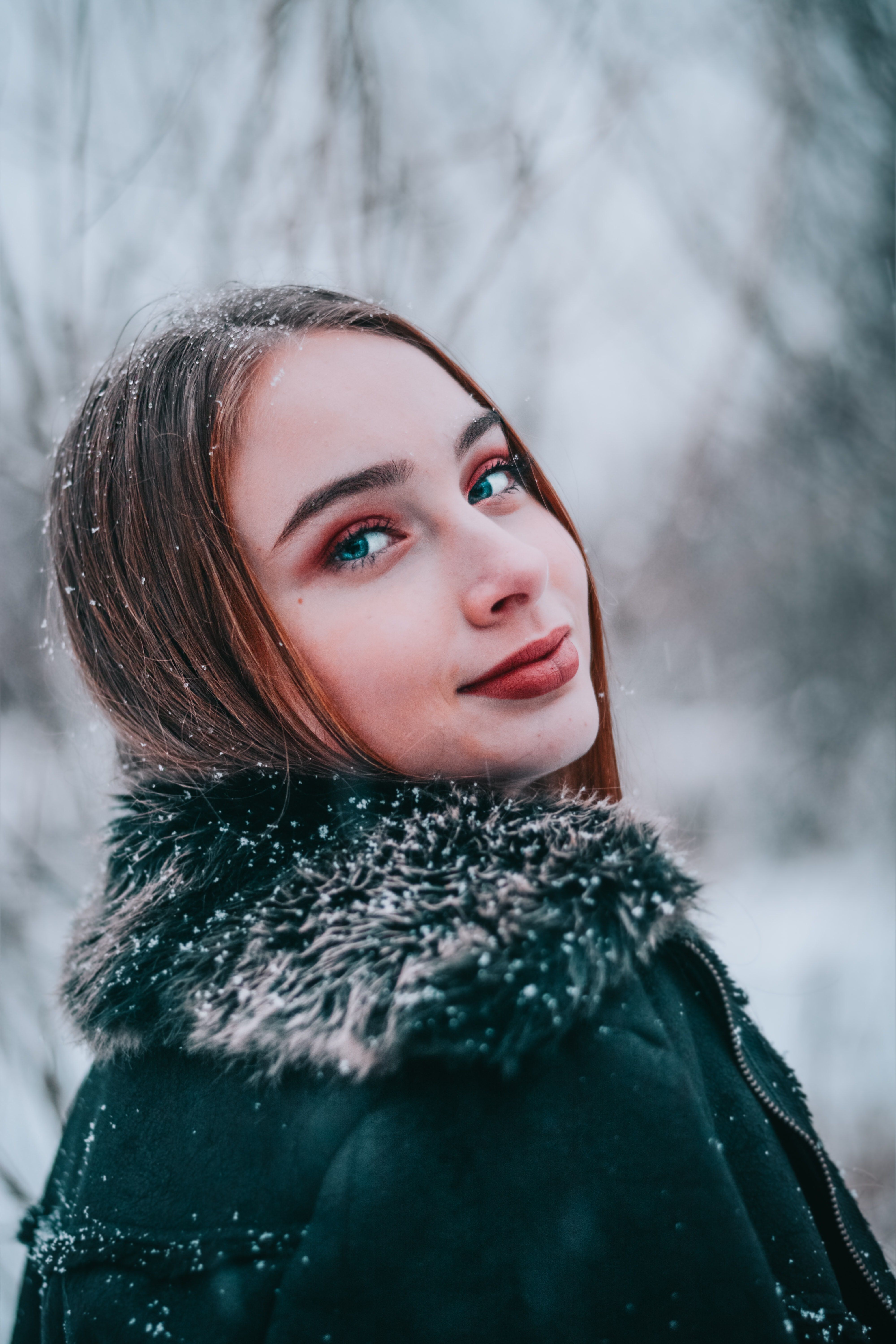 Portrait of Beautiful Woman with Moon in the Distance · Free Stock Photo