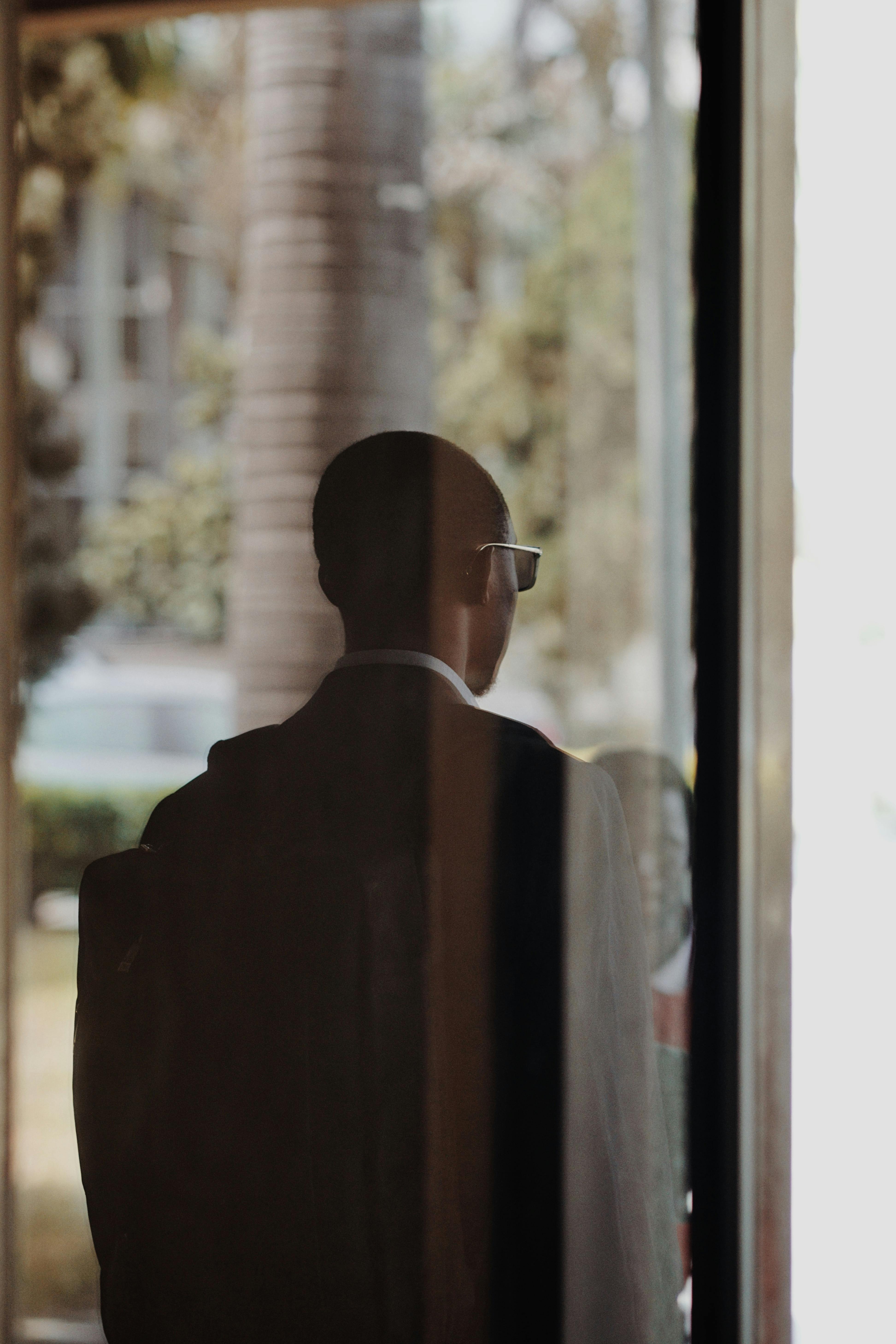 Man in Tuxedo Standing by Window · Free Stock Photo