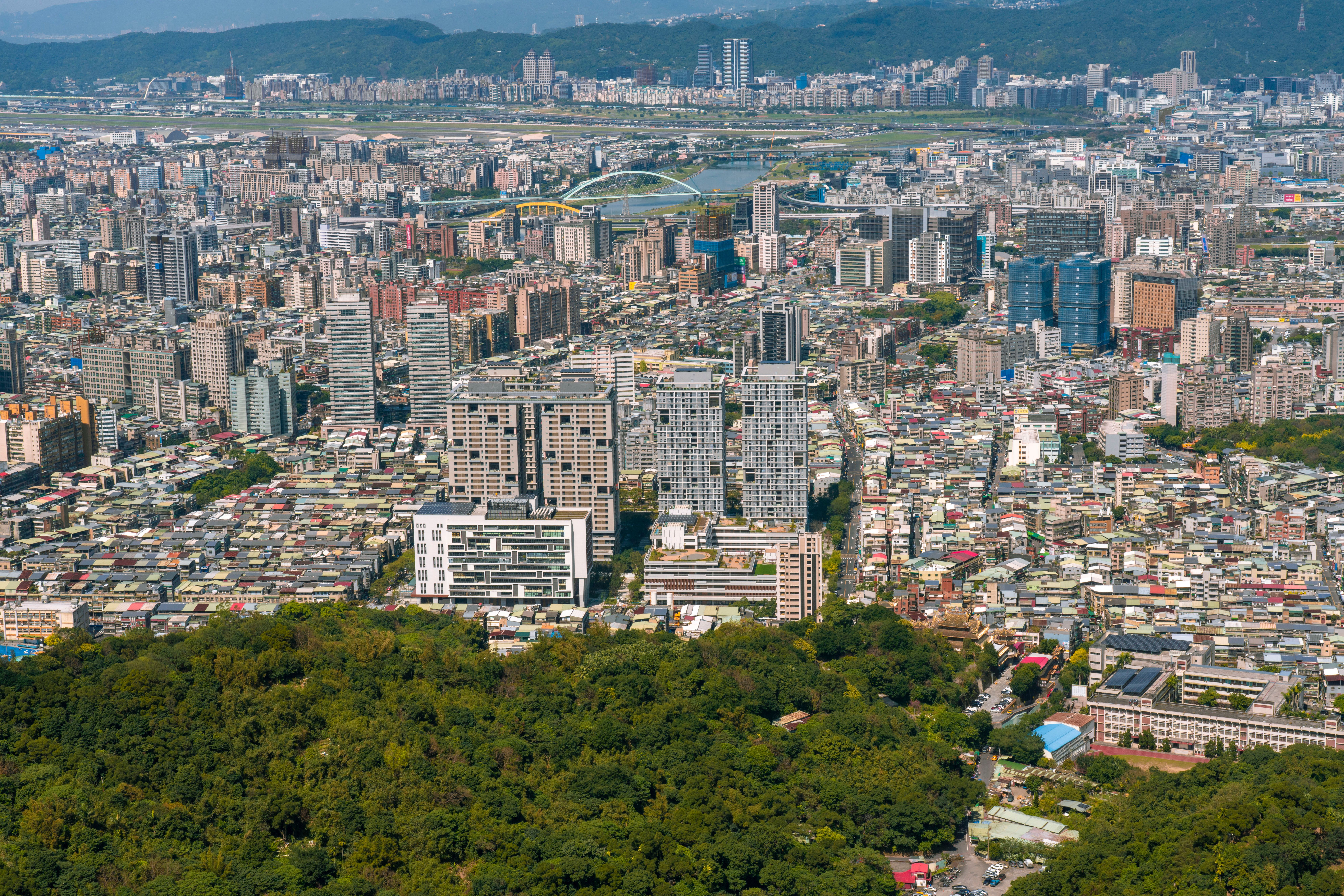 Forest and City Buildings behind · Free Stock Photo