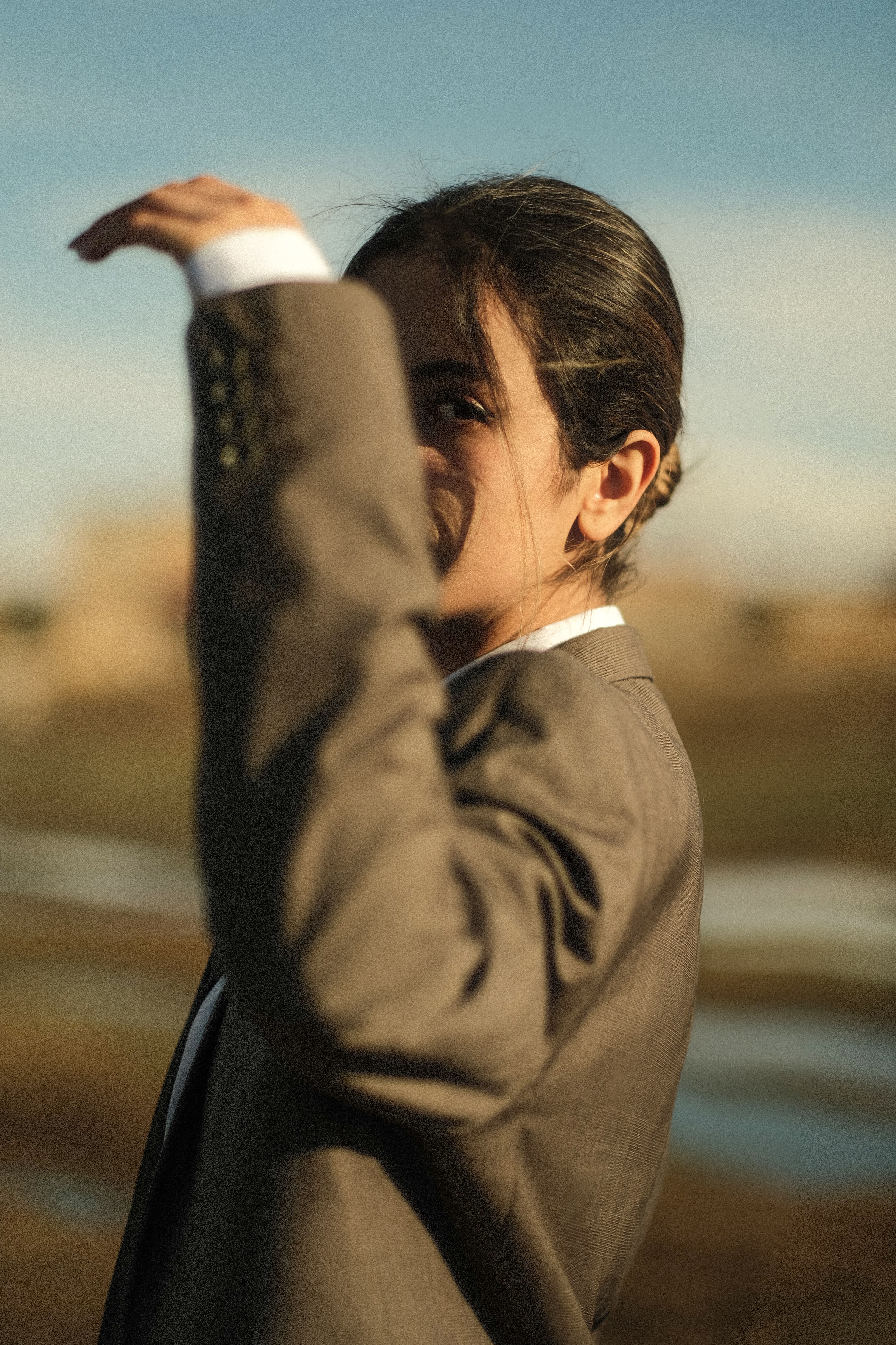 Photo of a Beautiful Young Girl in a Jacket Covering Her Face with Her ...