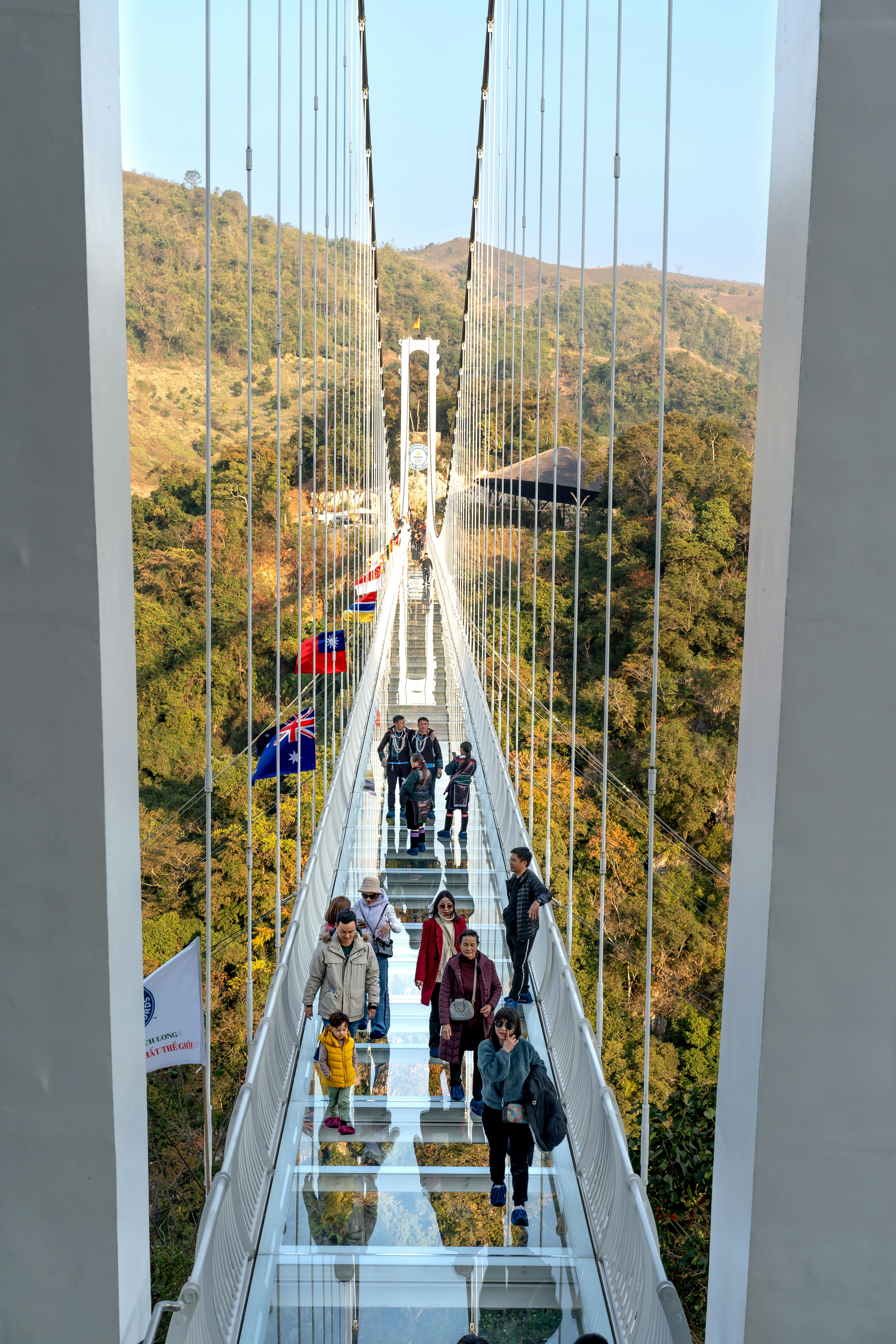People Walking on Bridge with Glass Pavement · Free Stock Photo