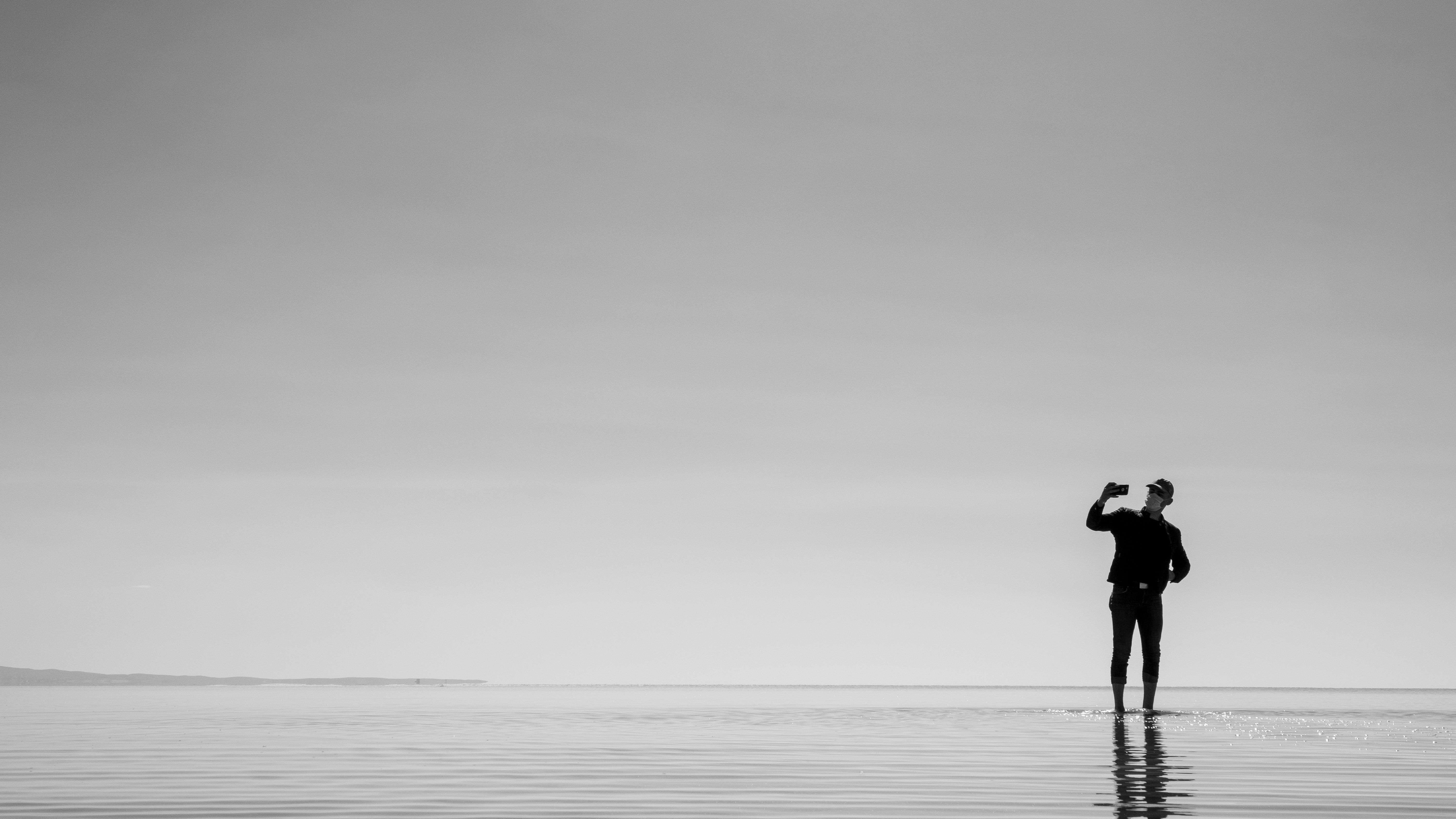 Lone Man Taking Photos with Smartphone on Beach · Free Stock Photo