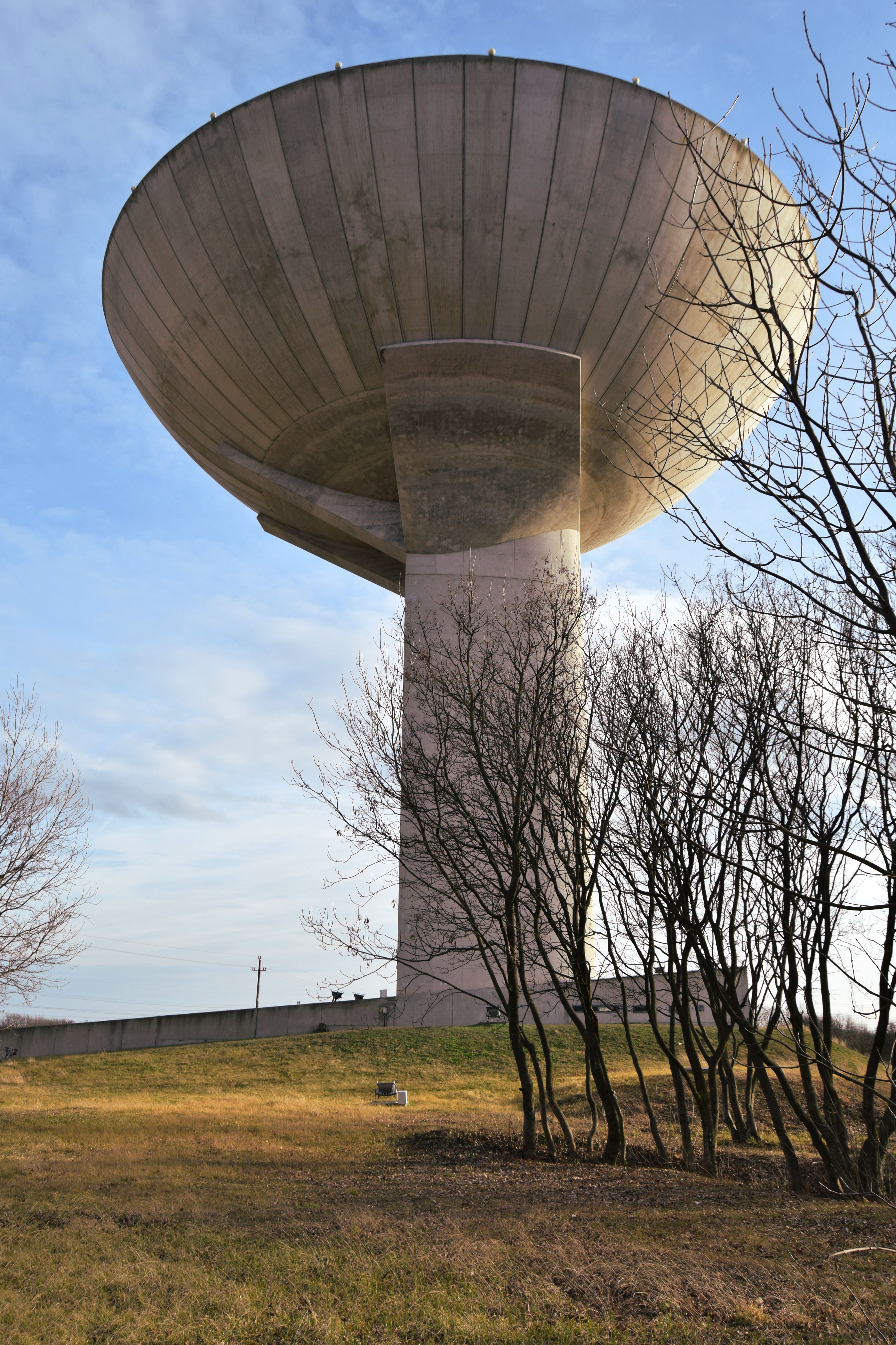 A water tower with a large water spout on top · Free Stock Photo