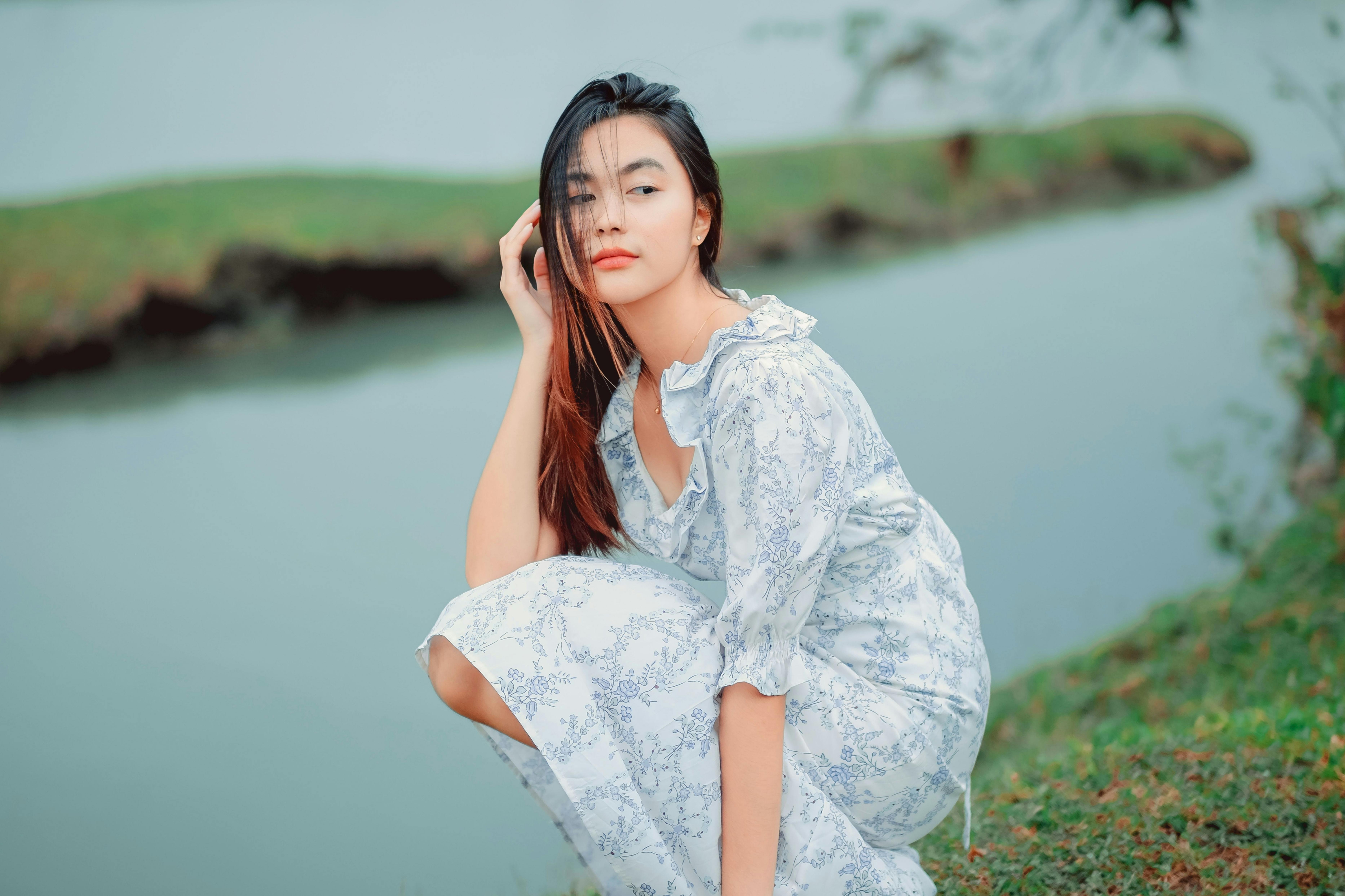 Crouching Woman in a Dress · Free Stock Photo