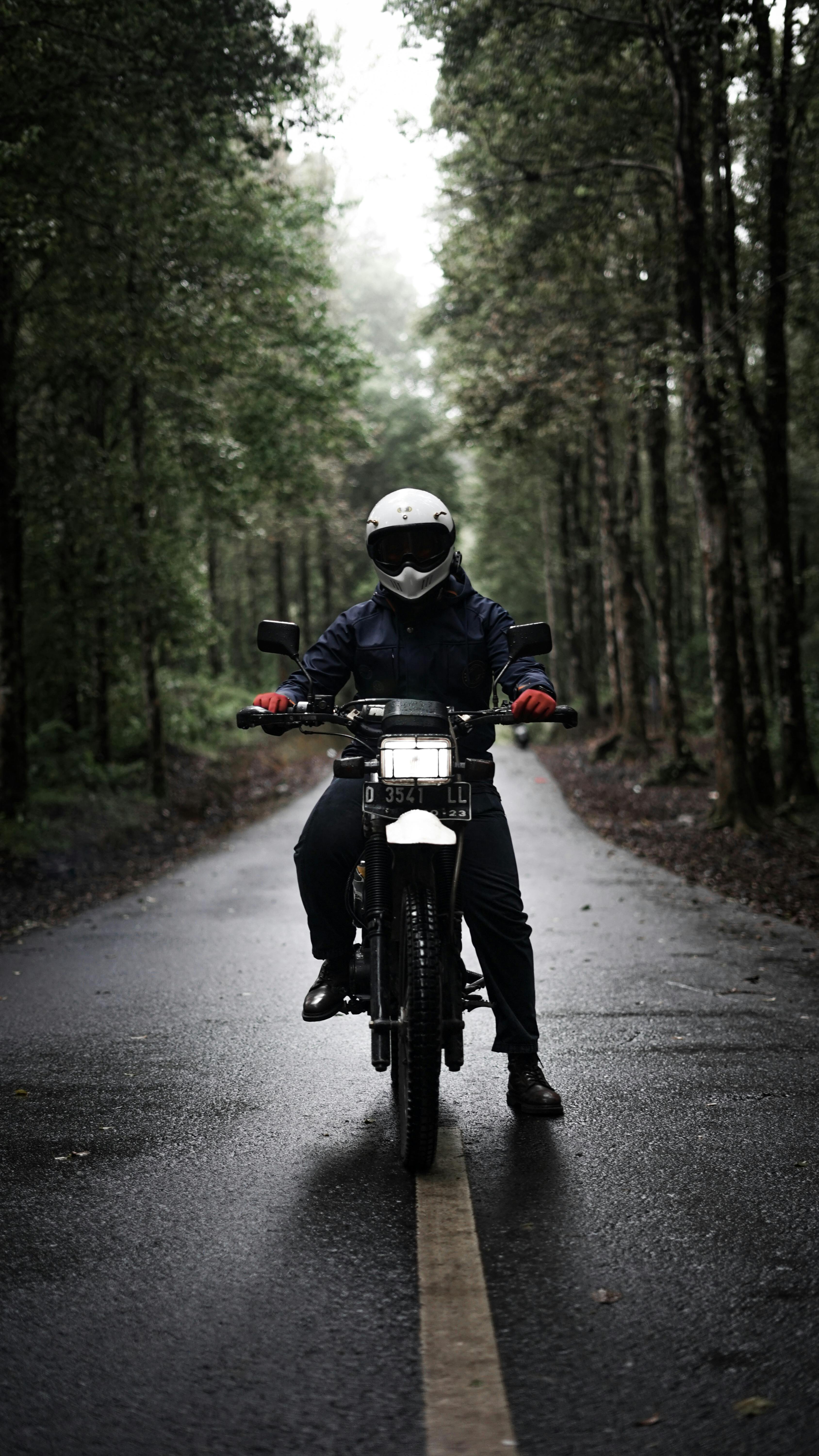 Photo of Man Riding Motorcycle in the Forest · Free Stock Photo