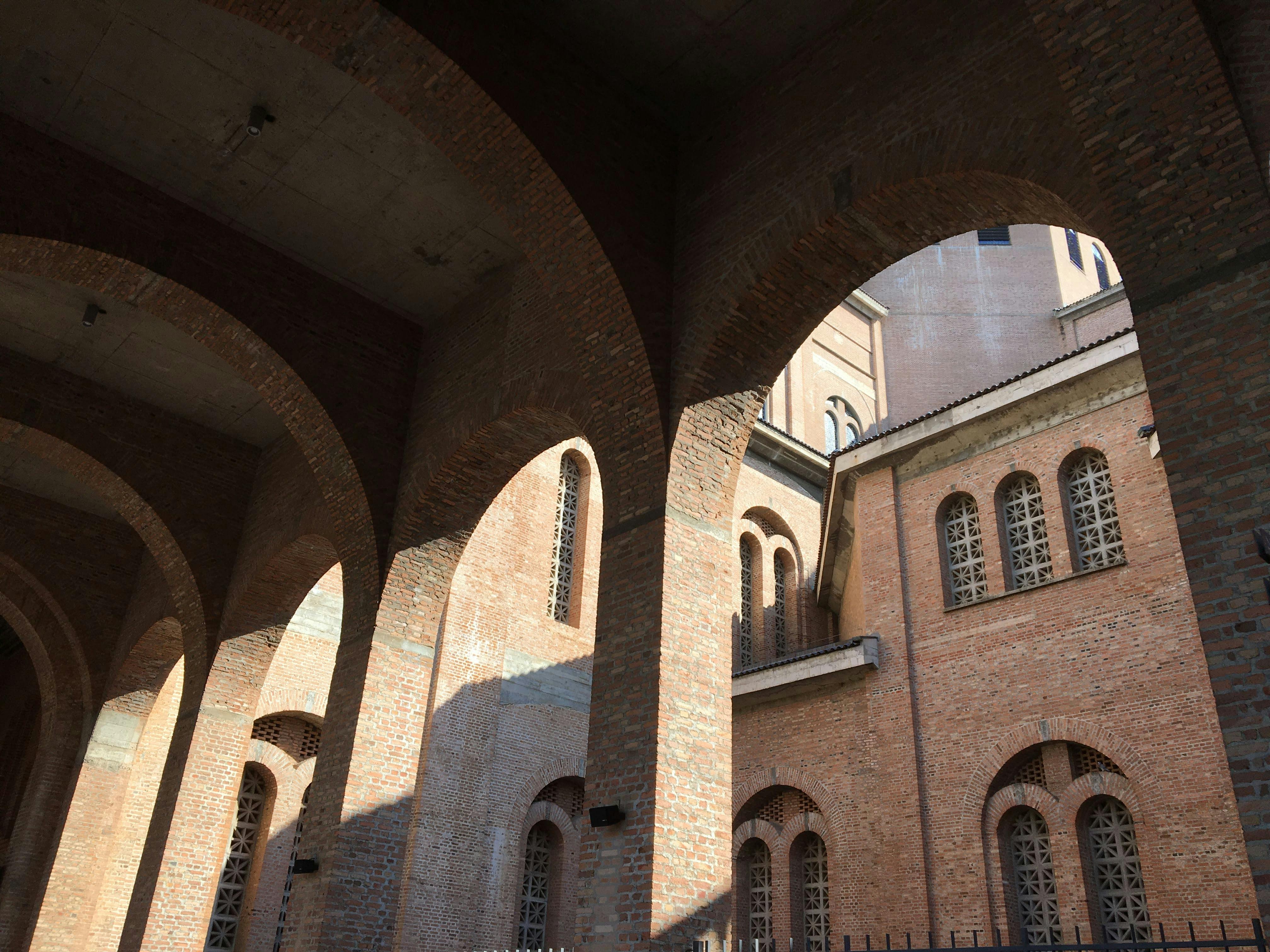 Arches in Gothic Courtyard · Free Stock Photo