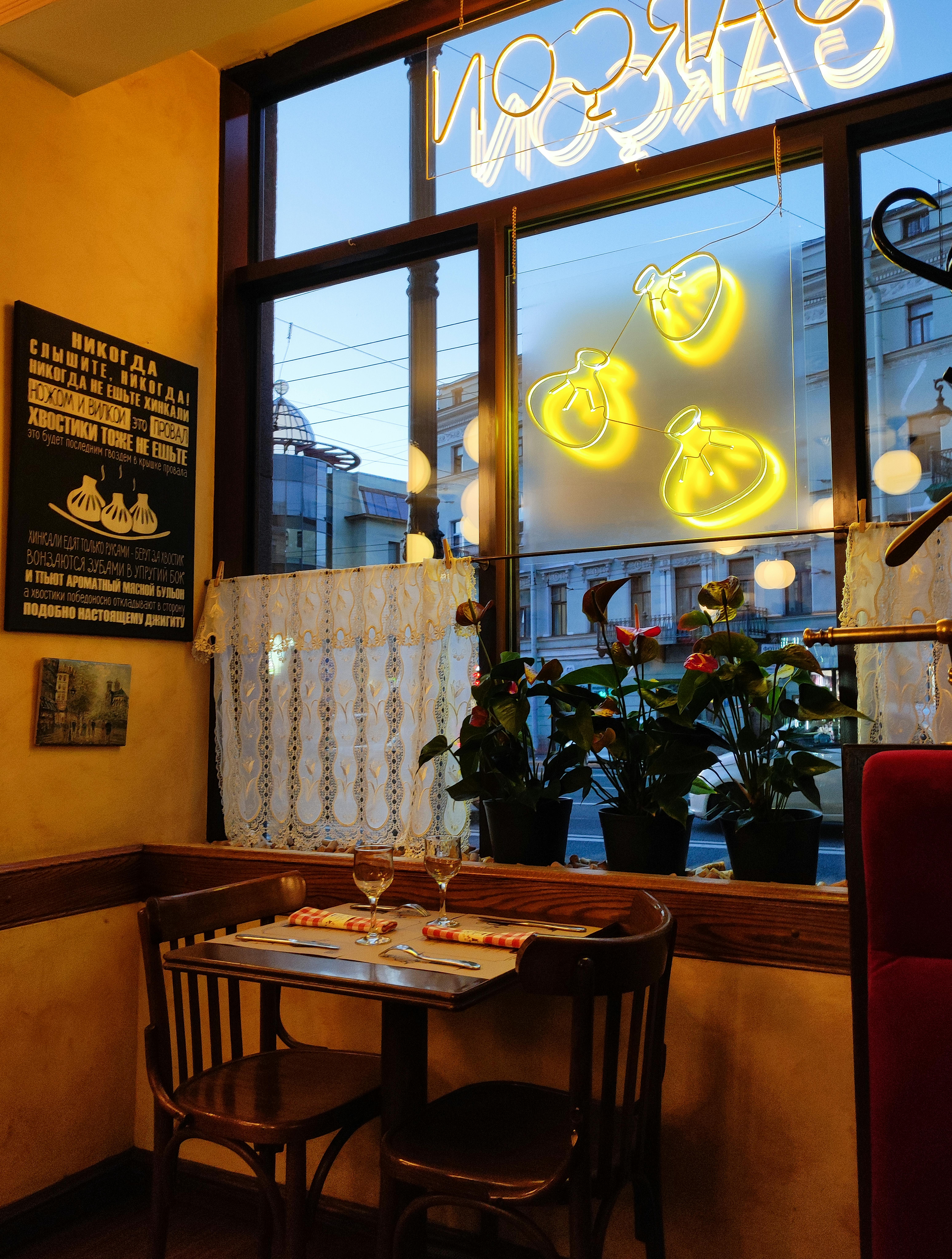 Small Restaurant Table in Front of a Window · Free Stock Photo