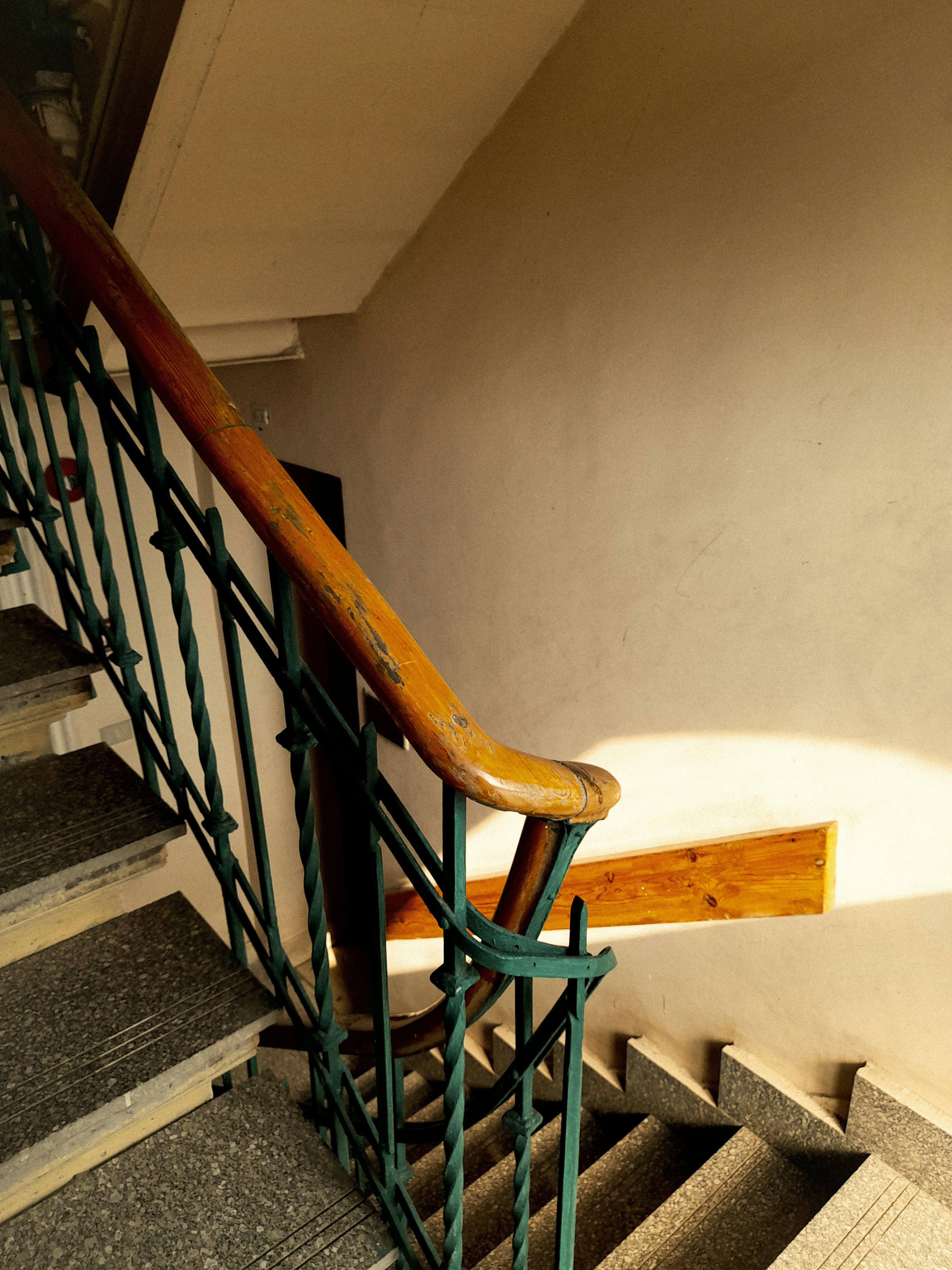 Elegant Staircase with Detailed Railing · Free Stock Photo