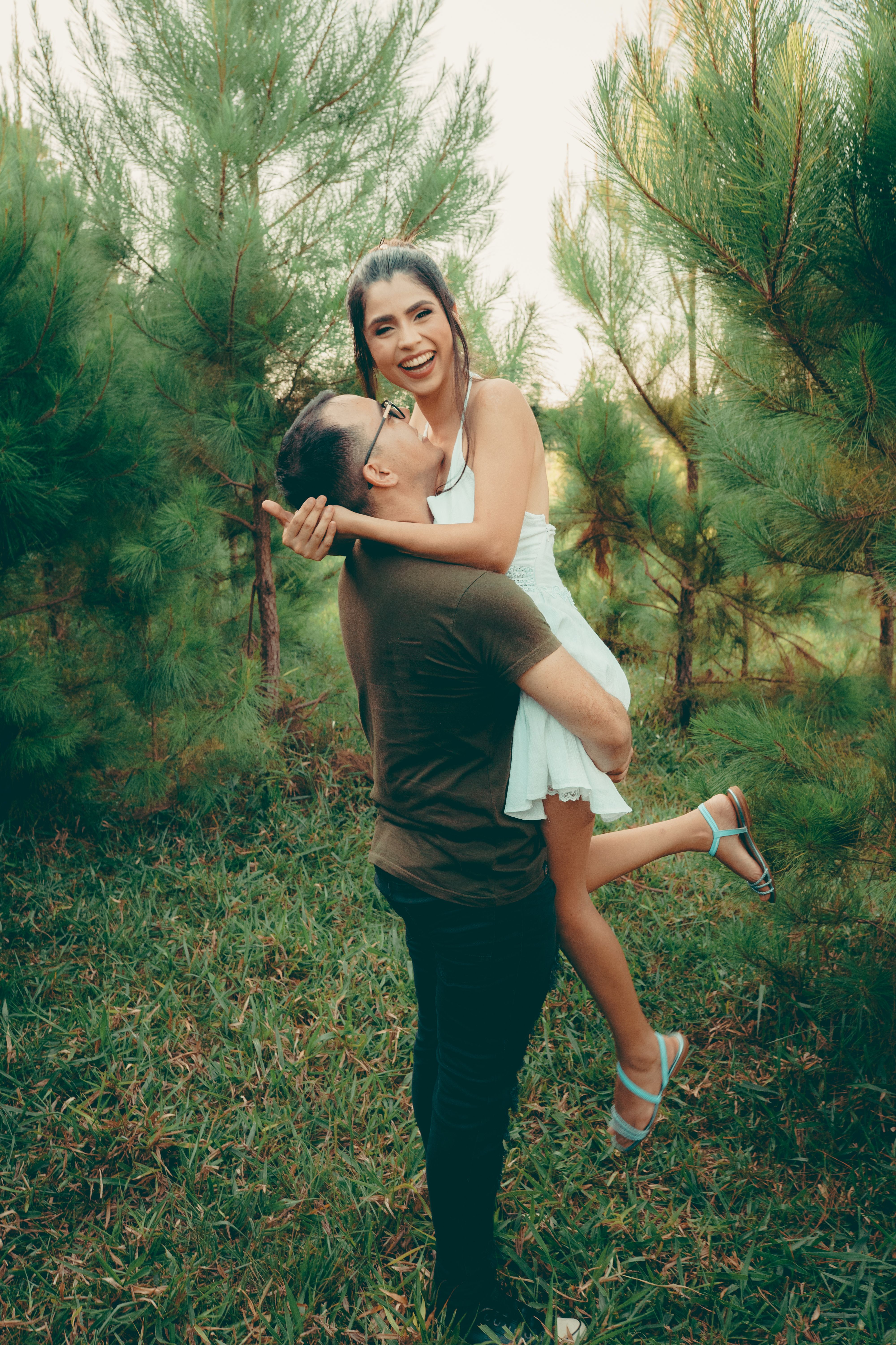 A Happy Young Couple Embracing · Free Stock Photo