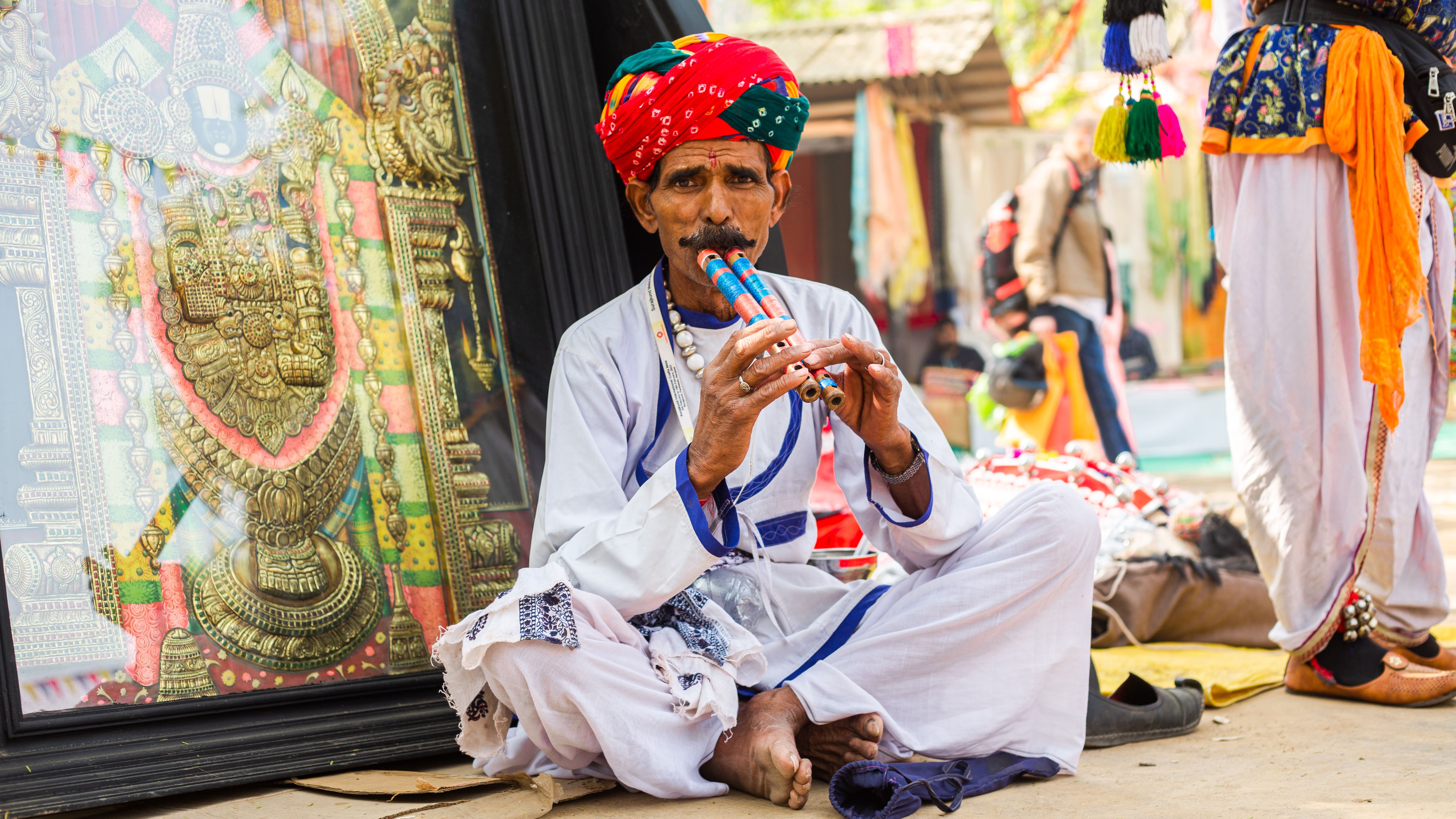 Man Playing Two Flutes at the Same Time · Free Stock Photo